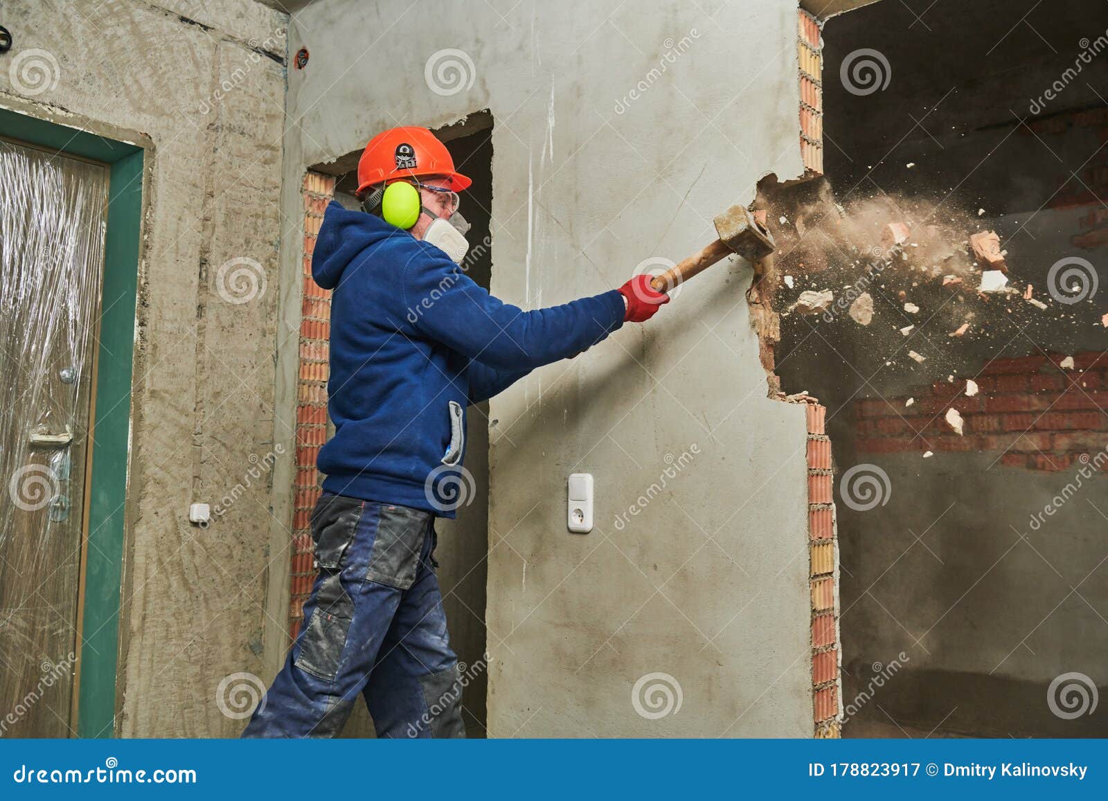 Demolition Work And Rearrangement. Worker With Sledgehammer Destroying ...