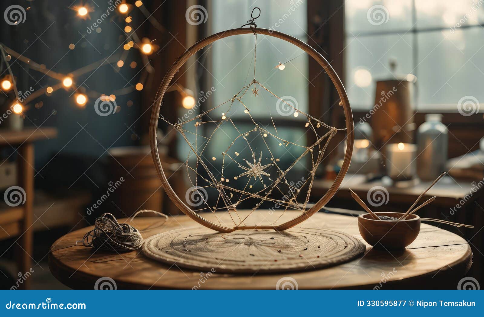 Wooden Table Topped with Glass Orb with Wire Star and String Lights ...