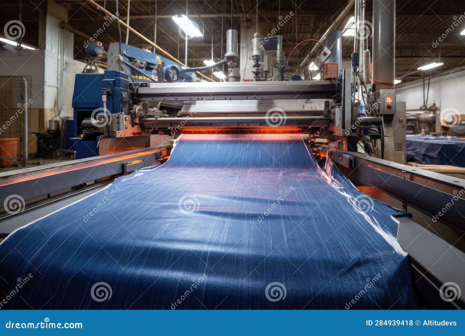 Denim Fabric Being Cut with Automated Machine Stock Photo - Image of ...