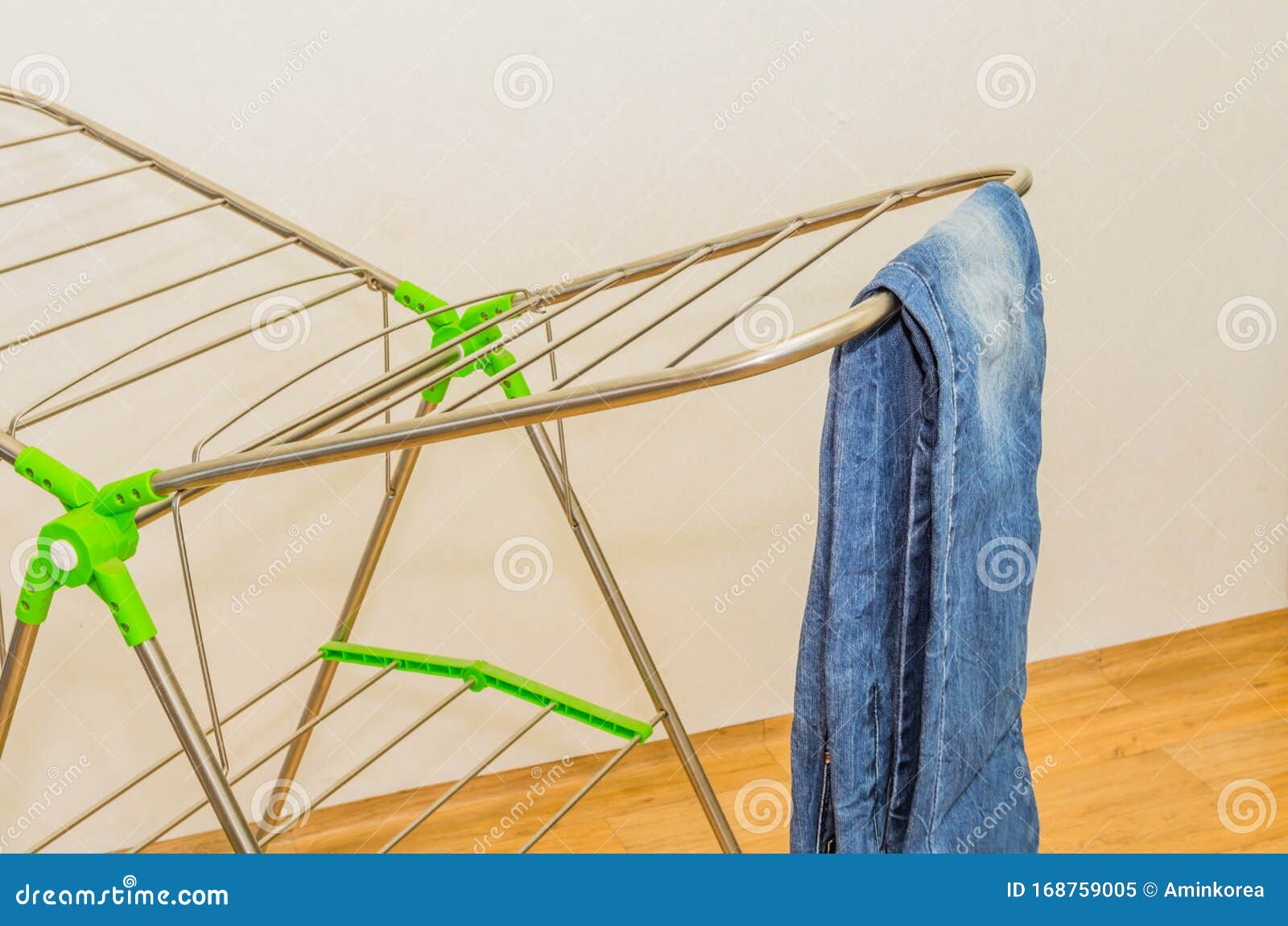 Denim jeans on drying rack stock image. Image of korea - 168759005
