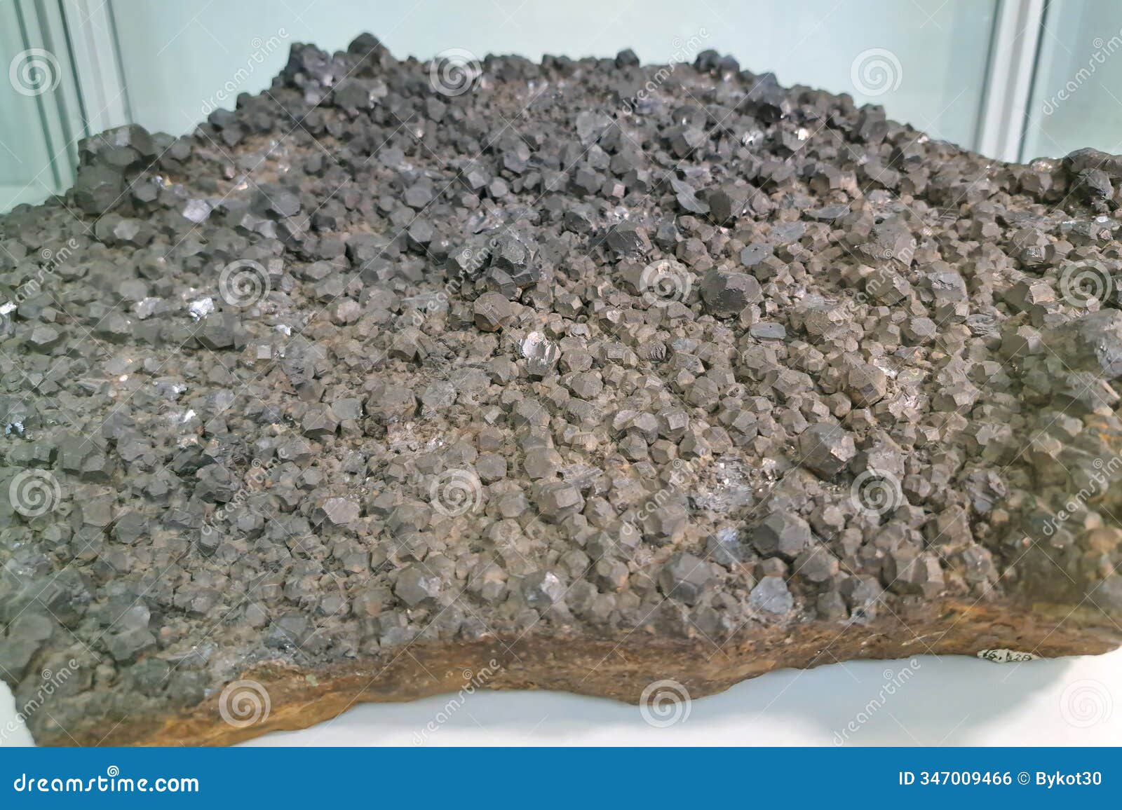 A Dense Cluster of Dark, Metallic Crystals with Sharp, Geometric Edges ...