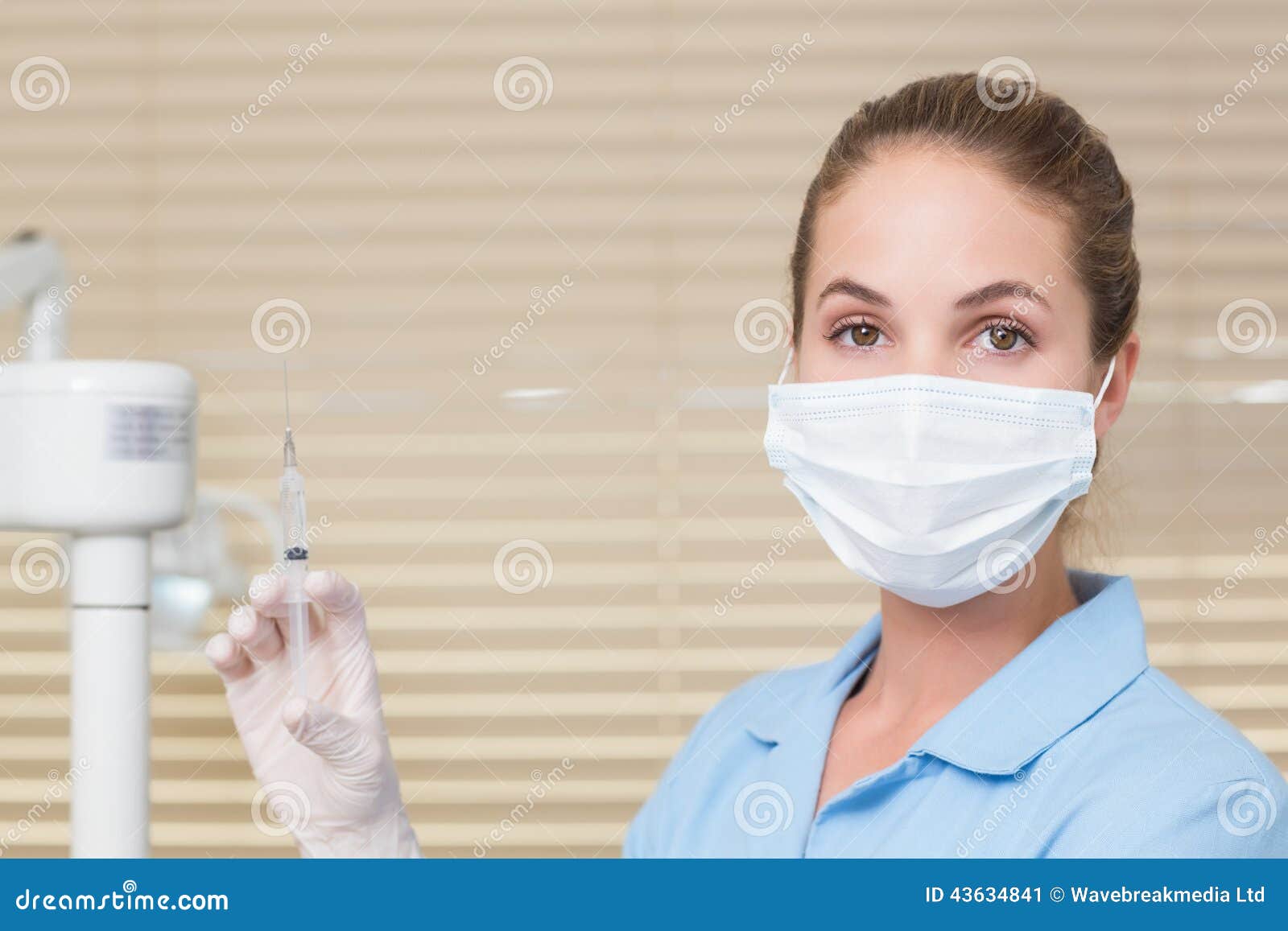 Dental Assistant Holding Injection Looking at Camera Stock Image ...
