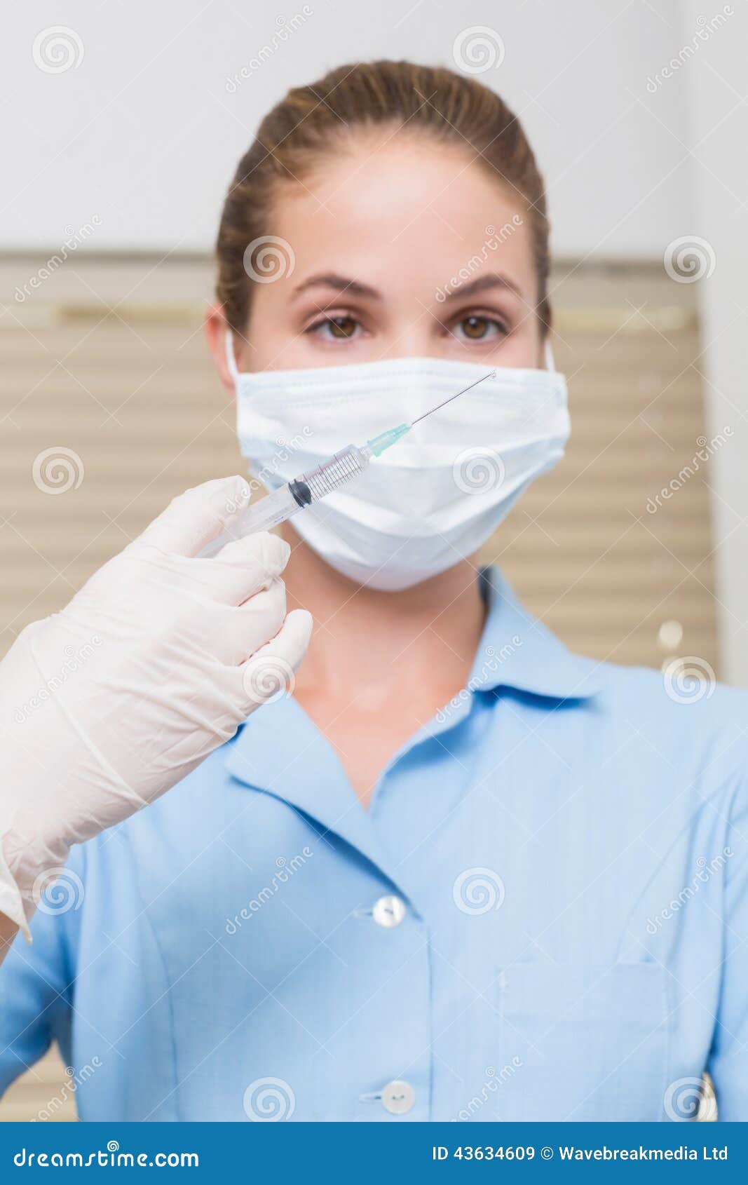 Dental Assistant Holding Injection Looking at it Stock Image - Image of ...