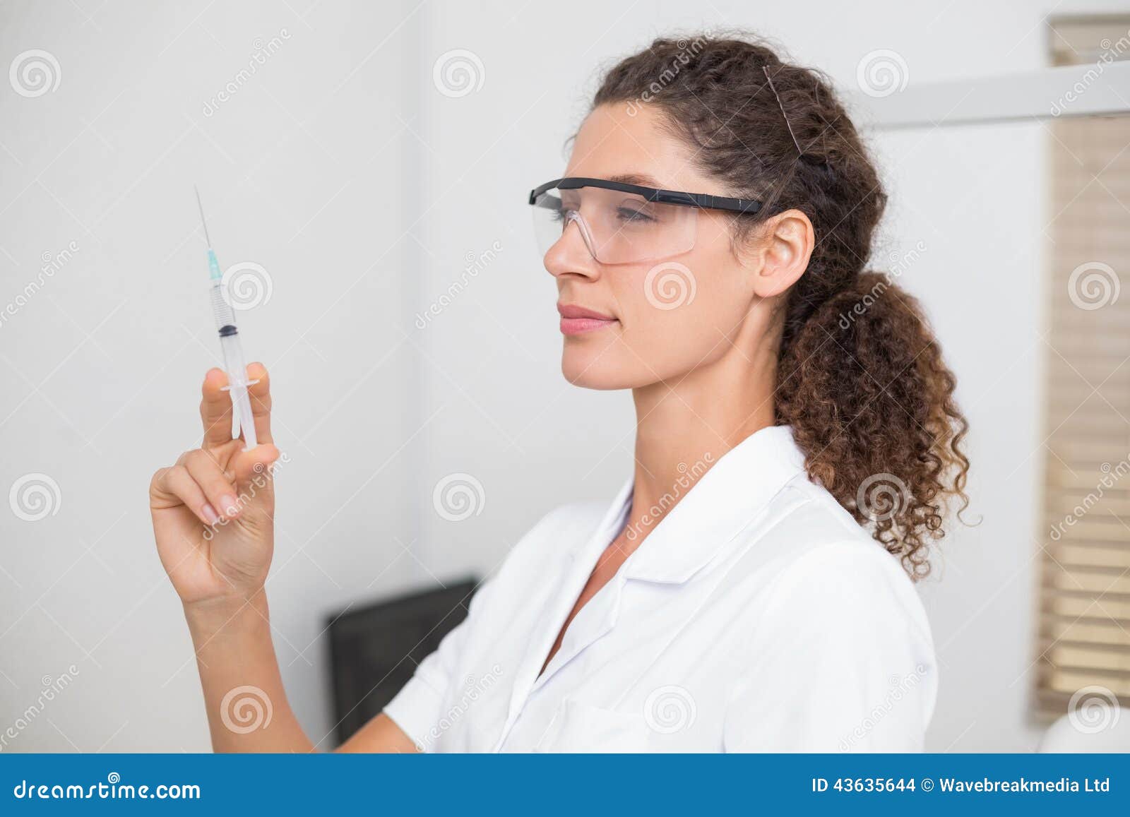 Dental Assistant Preparing an Injection Stock Photo - Image of ...
