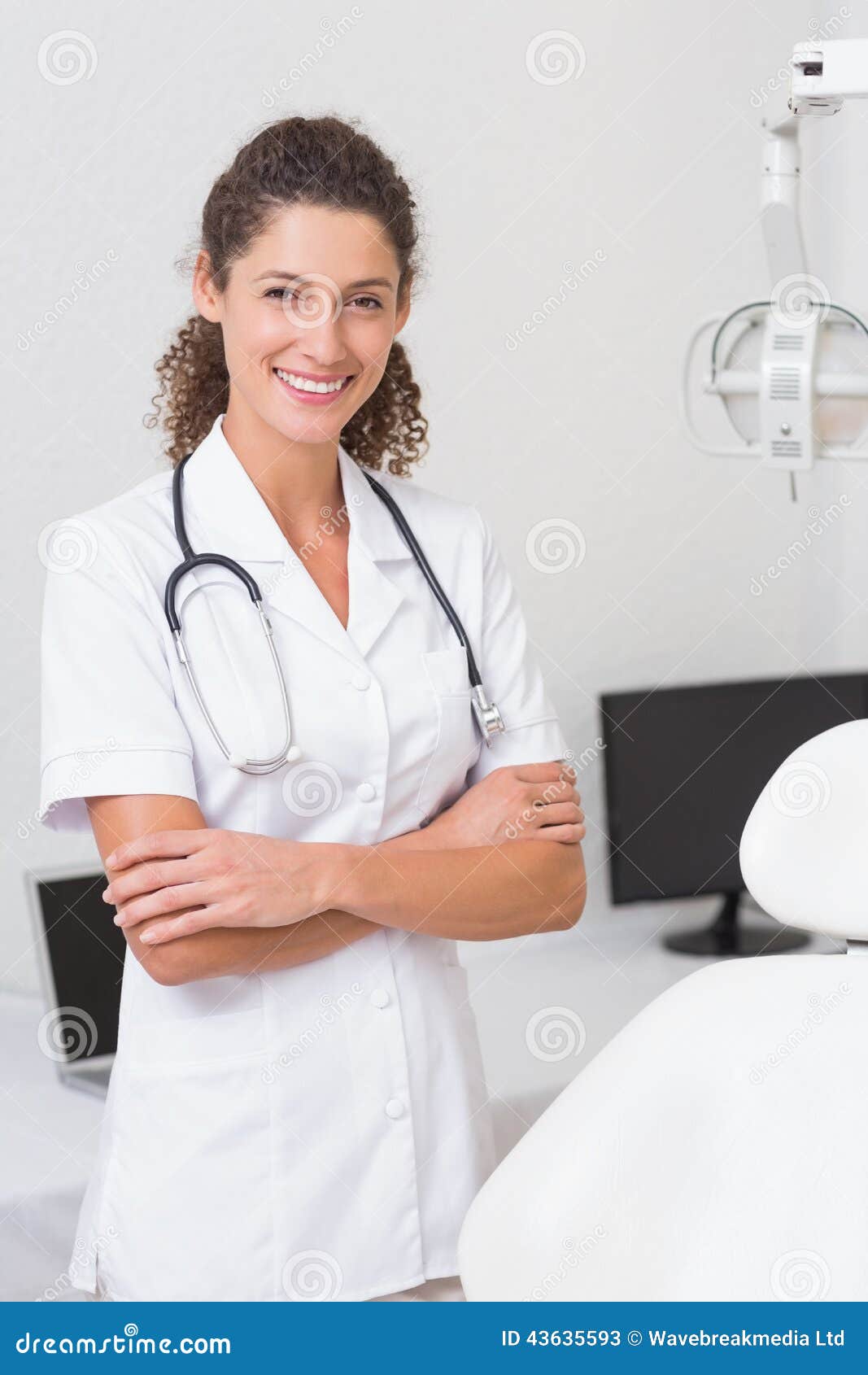 Dental Assistant Smiling at Camera beside Chair Stock Image - Image of ...