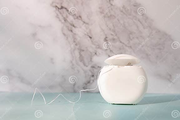 Daily Dental Care, Dental Floss Container on a Marble Background Stock ...