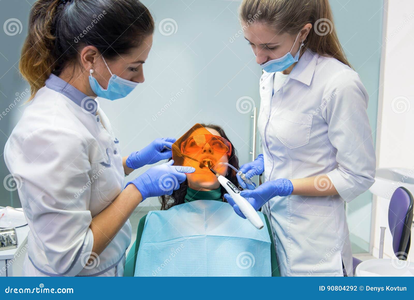 Dental Doctor Using Curing Light. Stock Photo - Image of hospital ...
