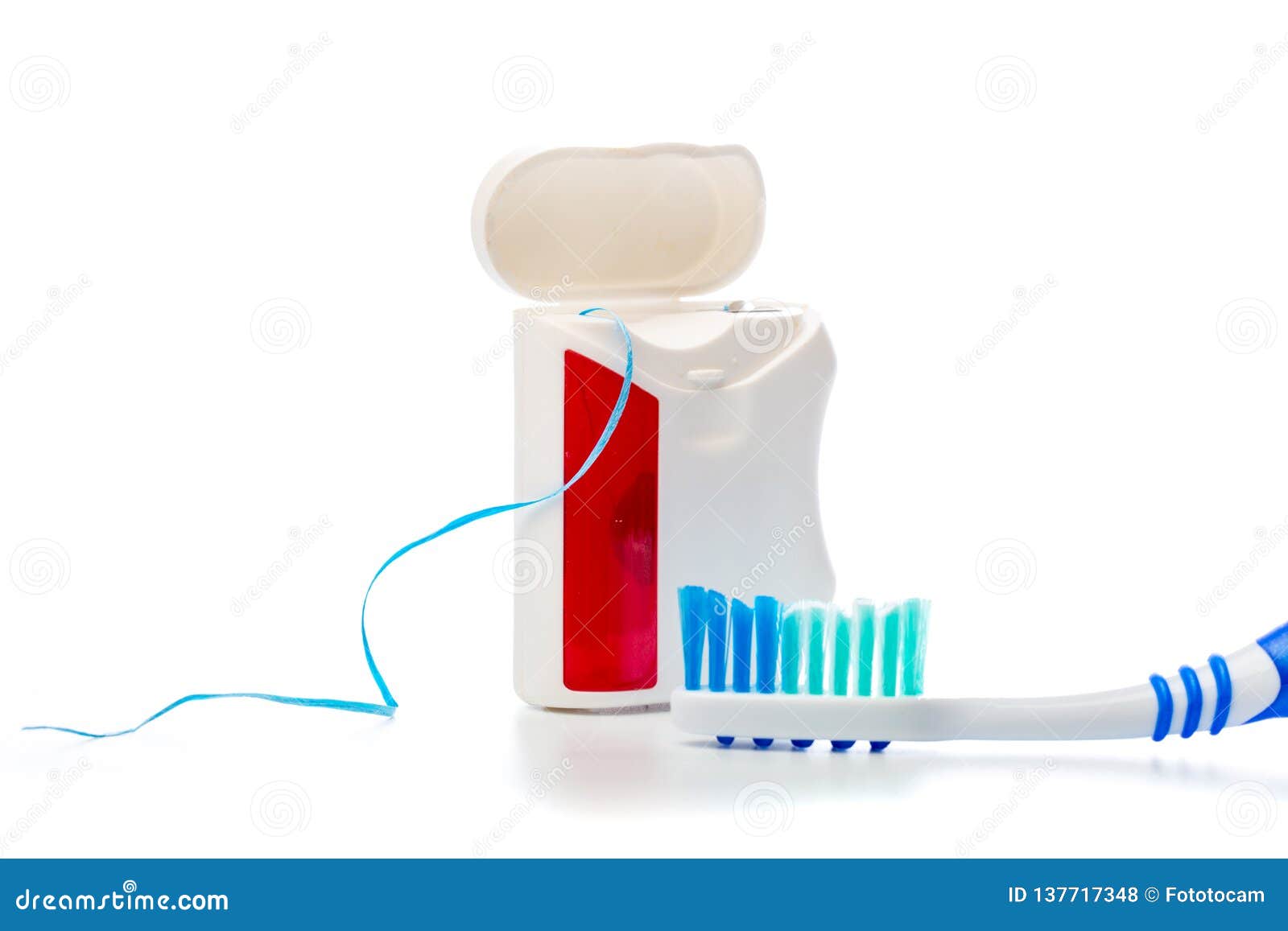 Dental Floss and Toothbrush on an Isolated Background Stock Photo ...