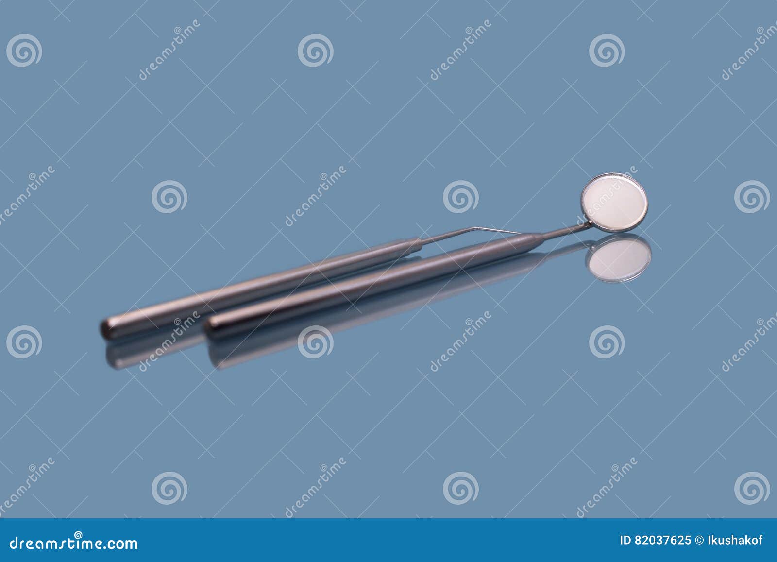 Dental Mirror and Dentist Probe. Image Isolated on Blue Background ...