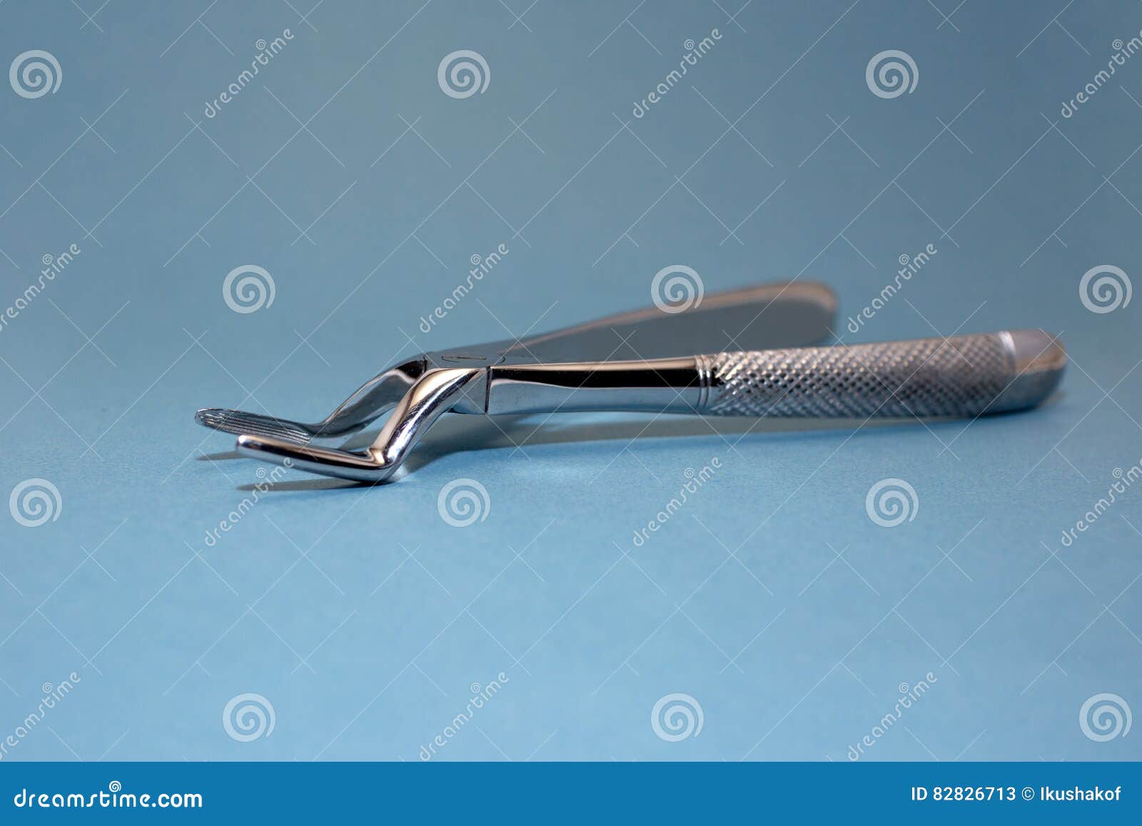 Dental Pincers To Remove the Front Teeth on Blue Background Stock Image ...