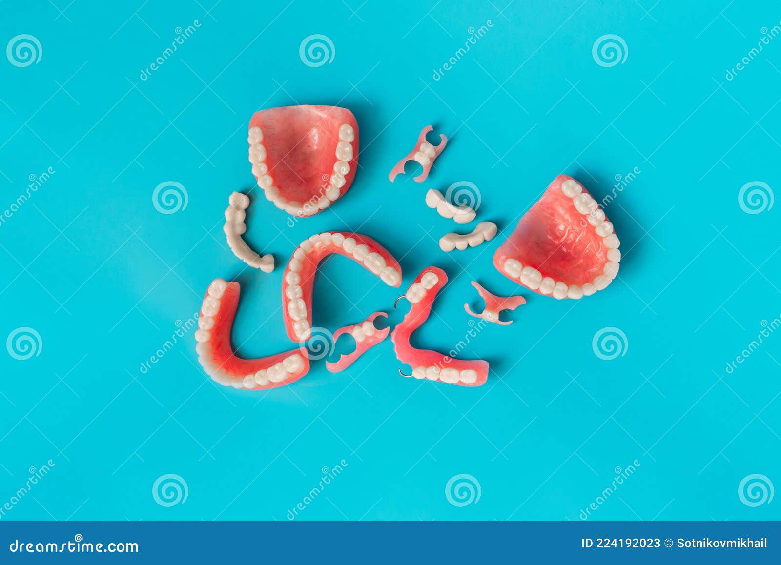 Dental Prosthetics on a Blue Background. Dentures. Prosthetic Teeth ...