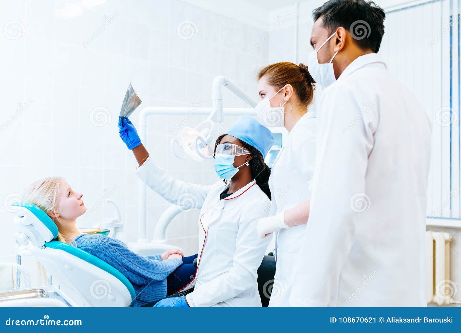 Multiracial Dental Team Checking Teeth X Ray of Patient. Dental Clinic ...