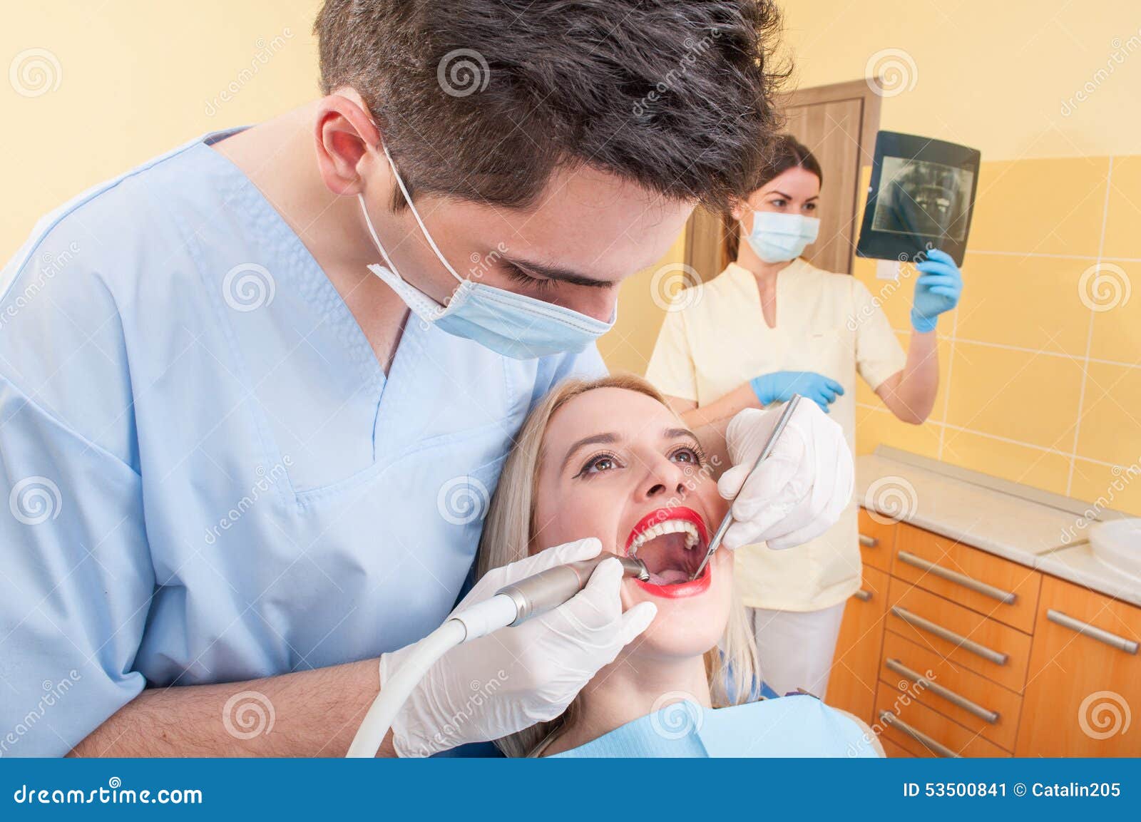 Dental team at work stock image. Image of assistant, chair - 53500841
