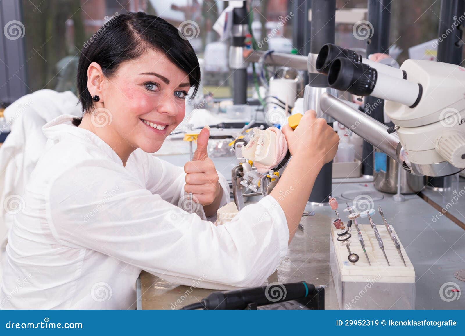 A Dental Technician Working on a Mold in a Laboratory Stock Image ...