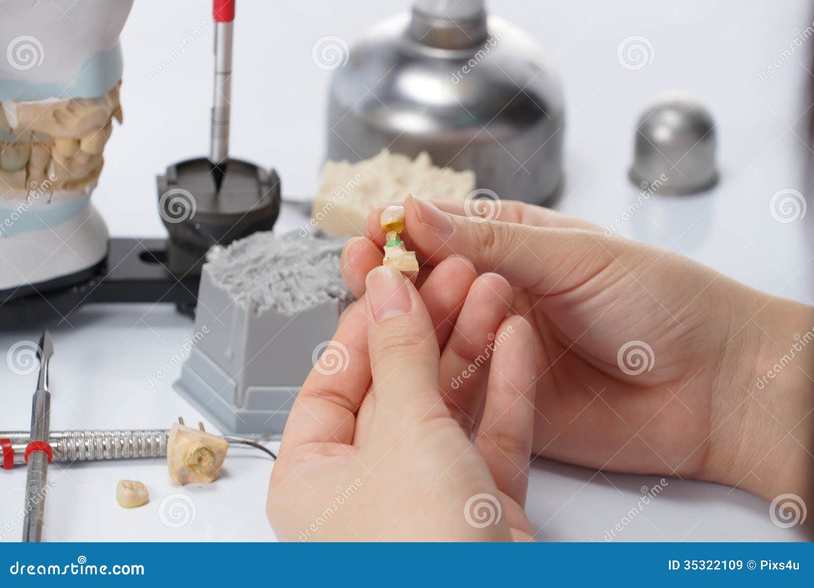 Dental Technician Working with Articulator in Dental Laboratory Stock ...