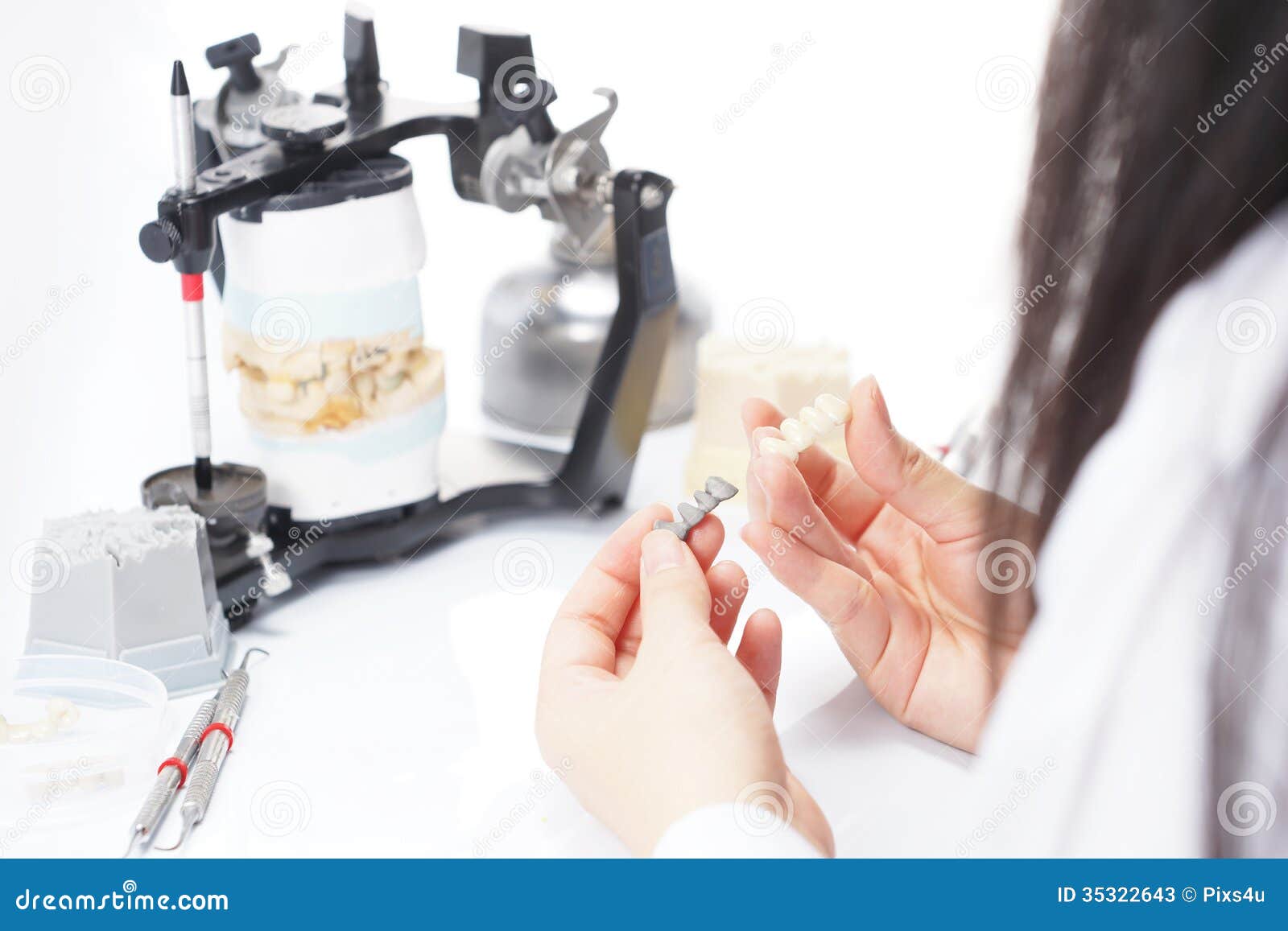 Dental Technician Working with Articulator in Dental Laboratory Stock ...