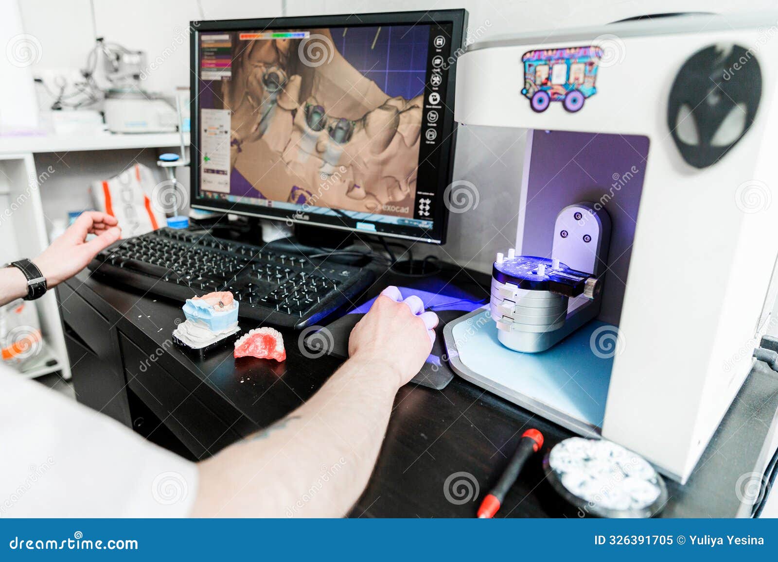 Dental Technician Working on a Computer. Minsk, Belarus- October 15 ...