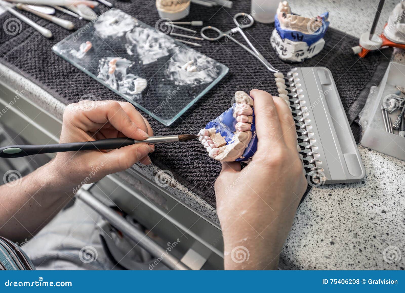 Dental technician working stock photo. Image of prosthetics - 75406208