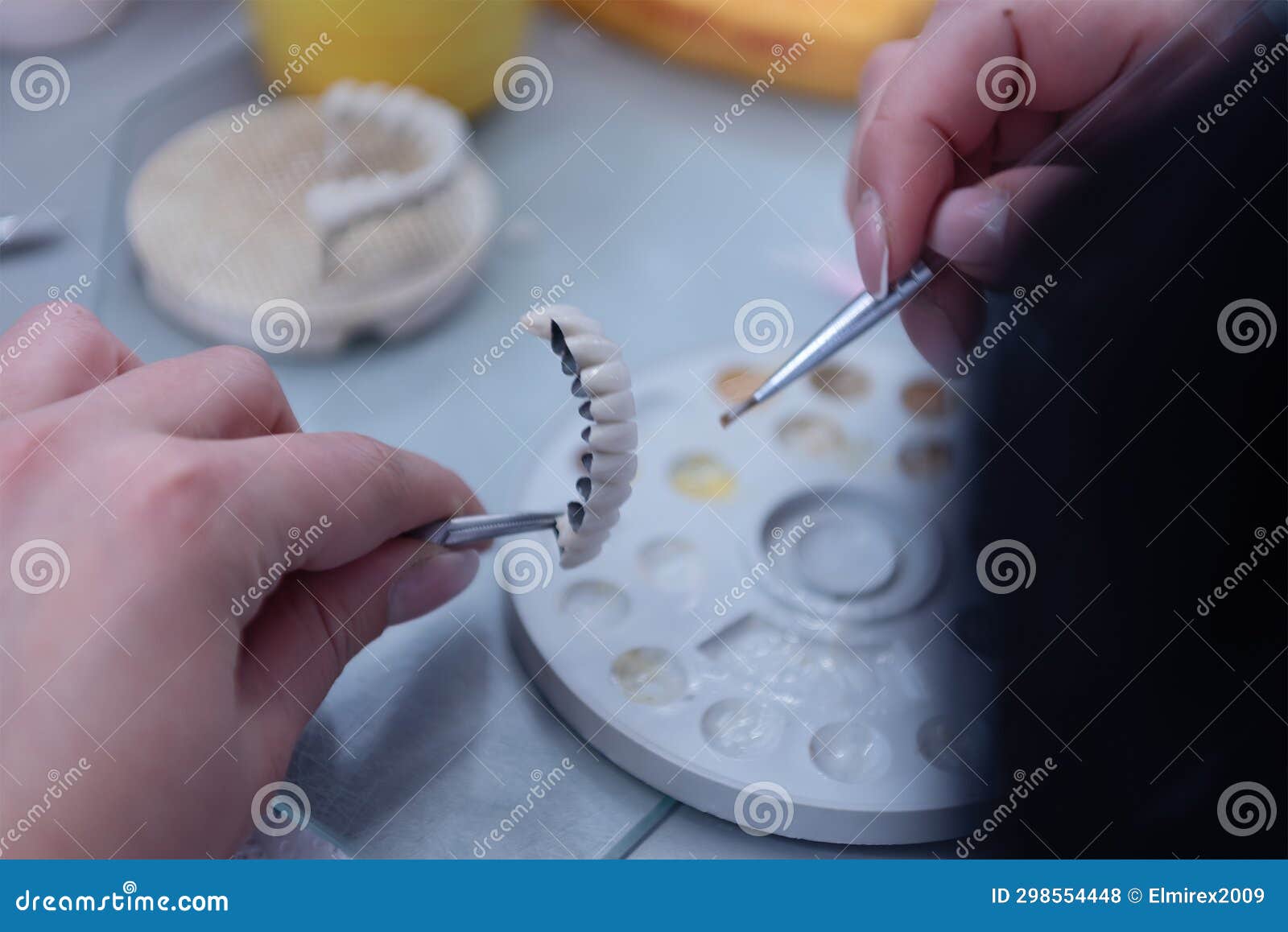 Dental Technician Working with Tooth Denture at Prosthesis Laboratory ...