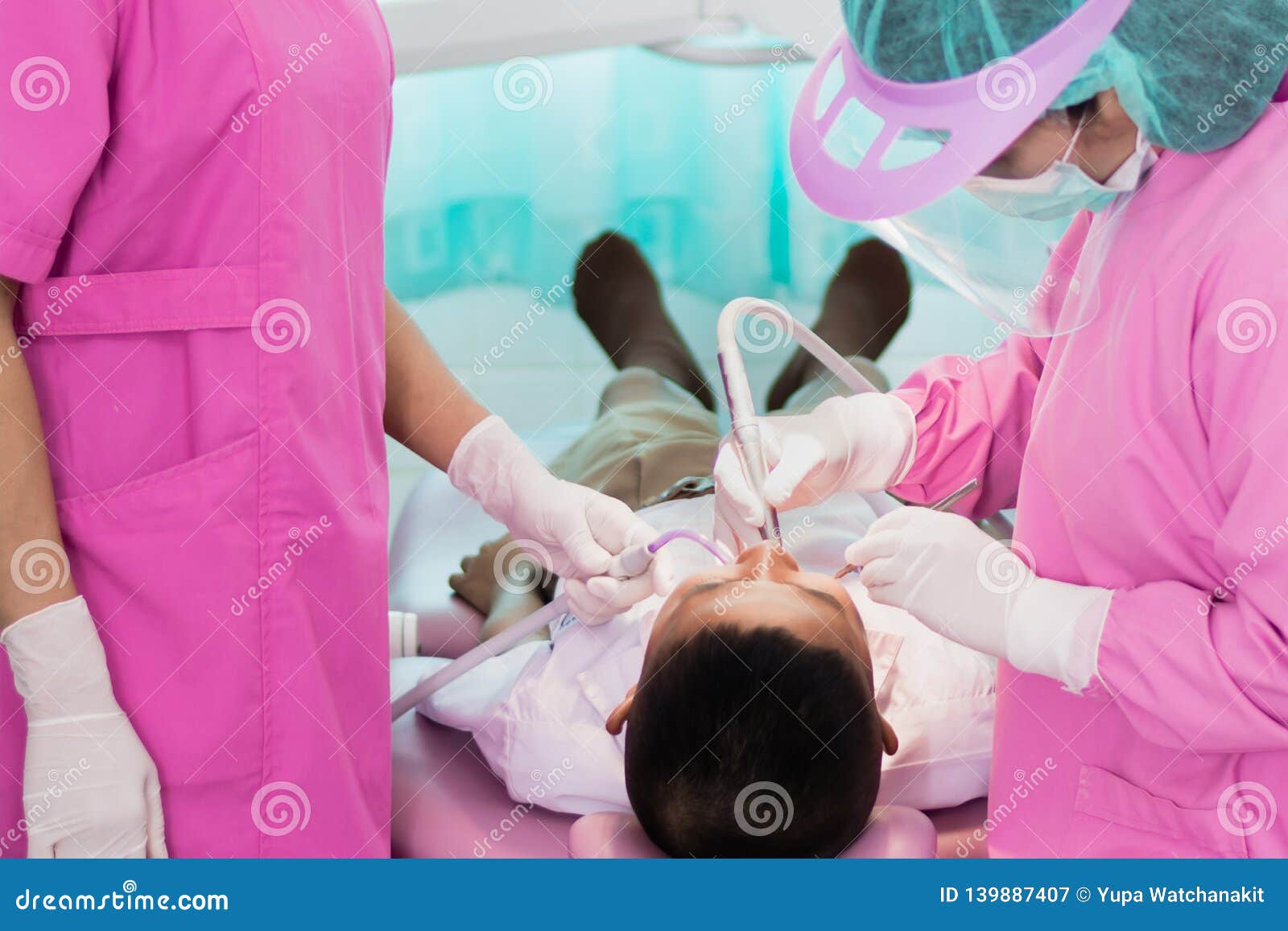 Dentist and Dentist Assistant Checking Teeth for Children Stock Image ...