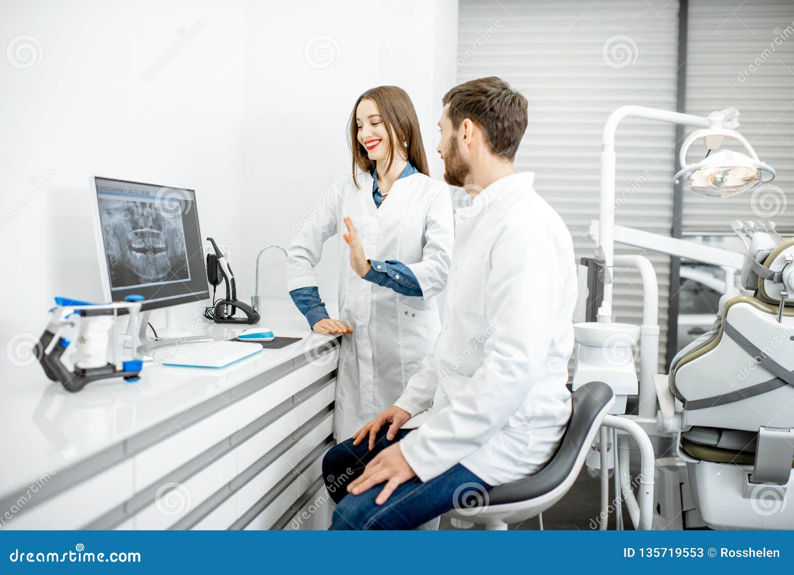 Dentist with Assistant in the Dental Office Stock Image - Image of ...