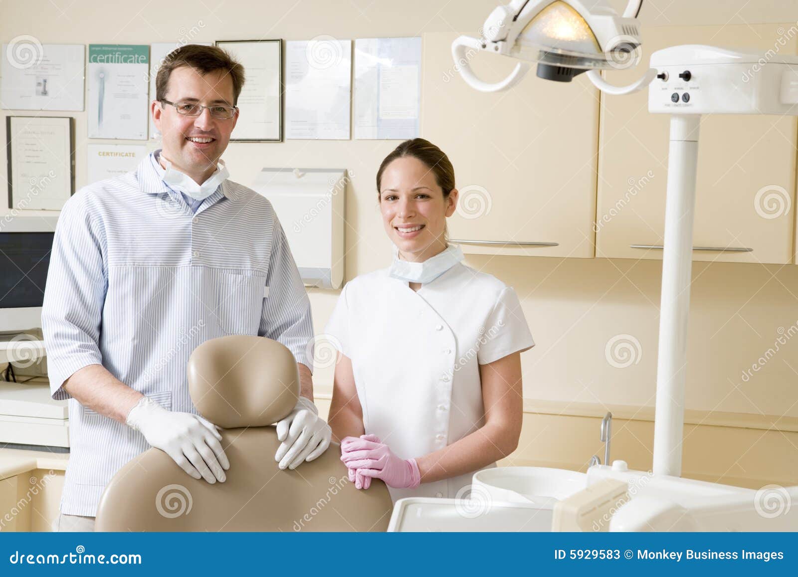 Dentist and Assistant in Exam Room Stock Image - Image of dental ...