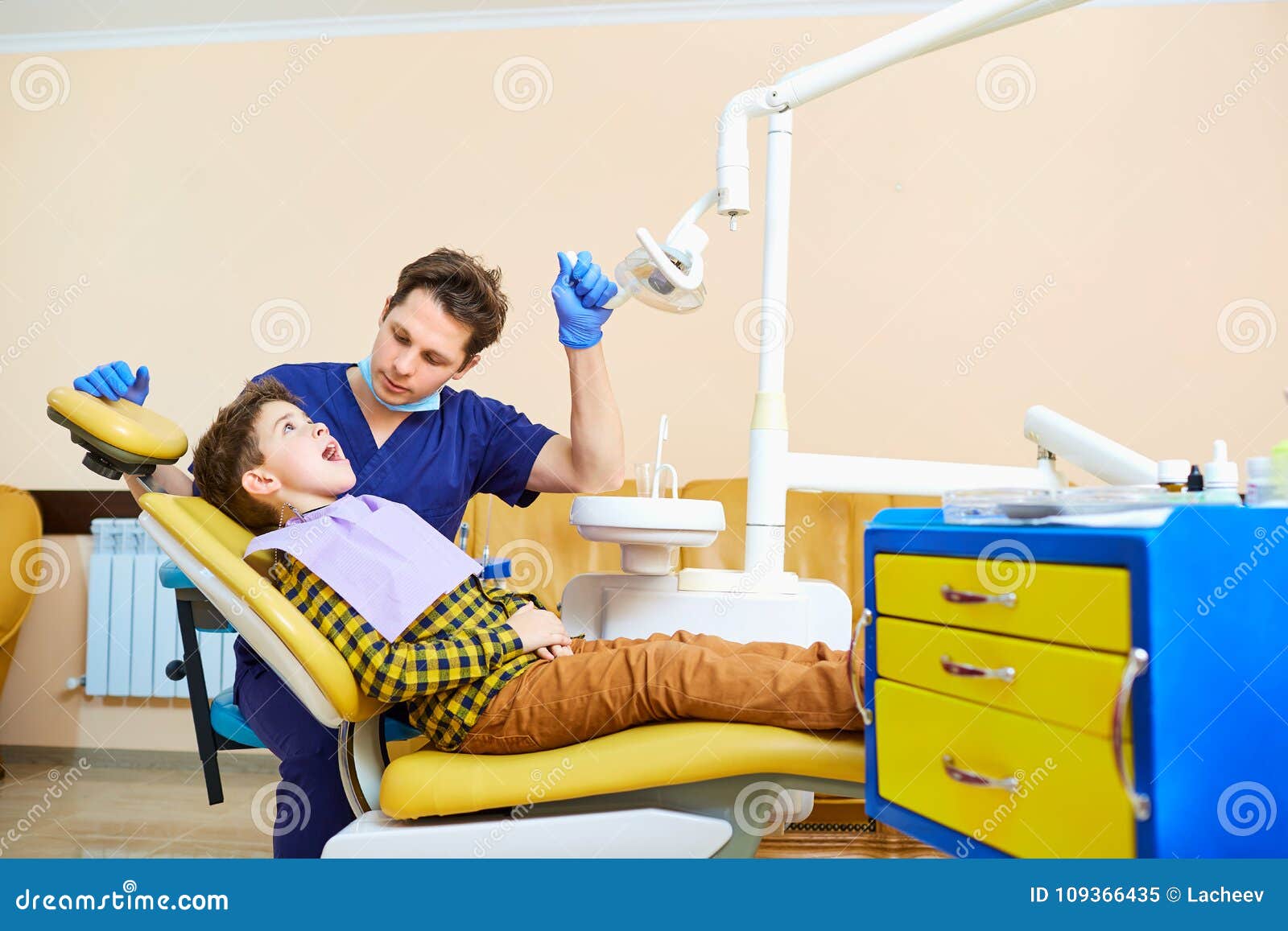 The Dentist Checking the Teeth of Boy Teenager. Stock Image - Image of ...