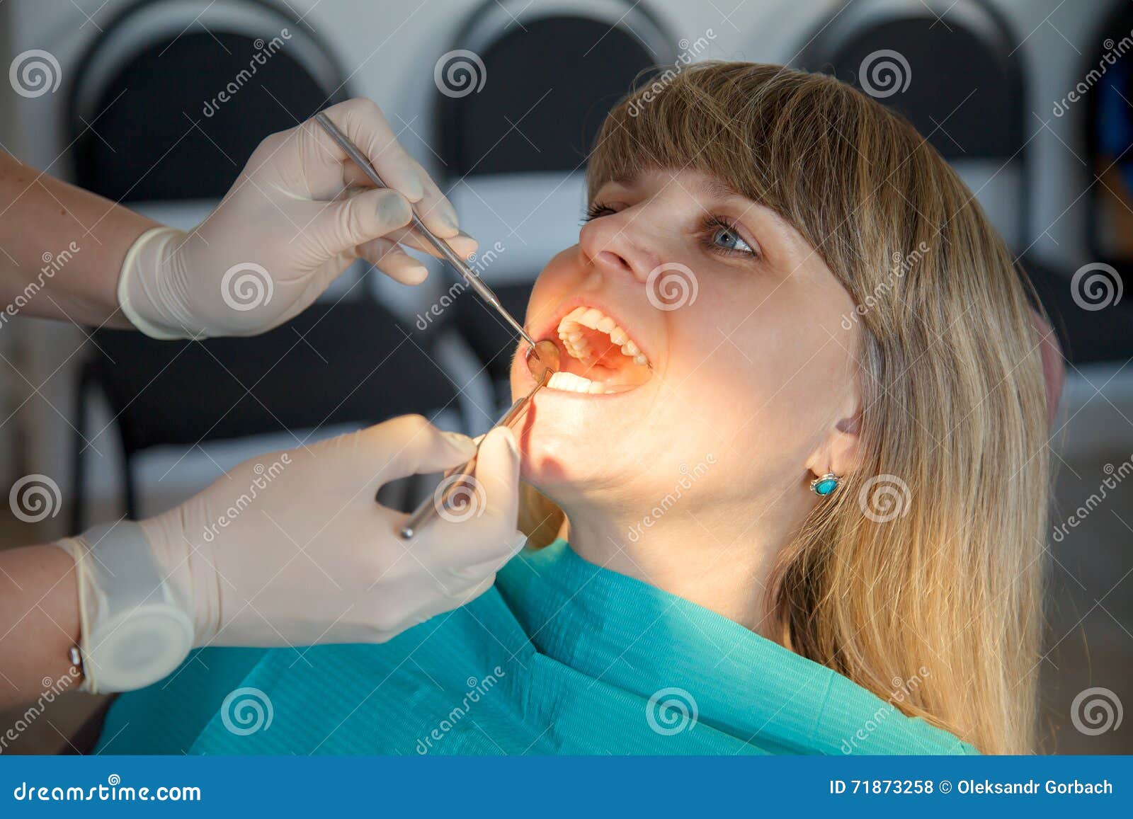 Dentist Checking a Woman for Cavities. Stock Photo - Image of cavity ...