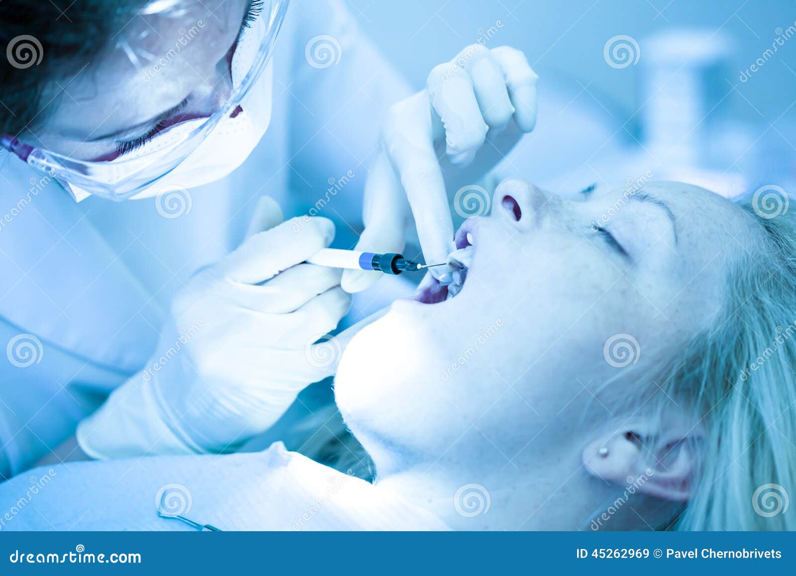 Dentist Curing a Female Patient Stock Image - Image of teeth, procedure ...