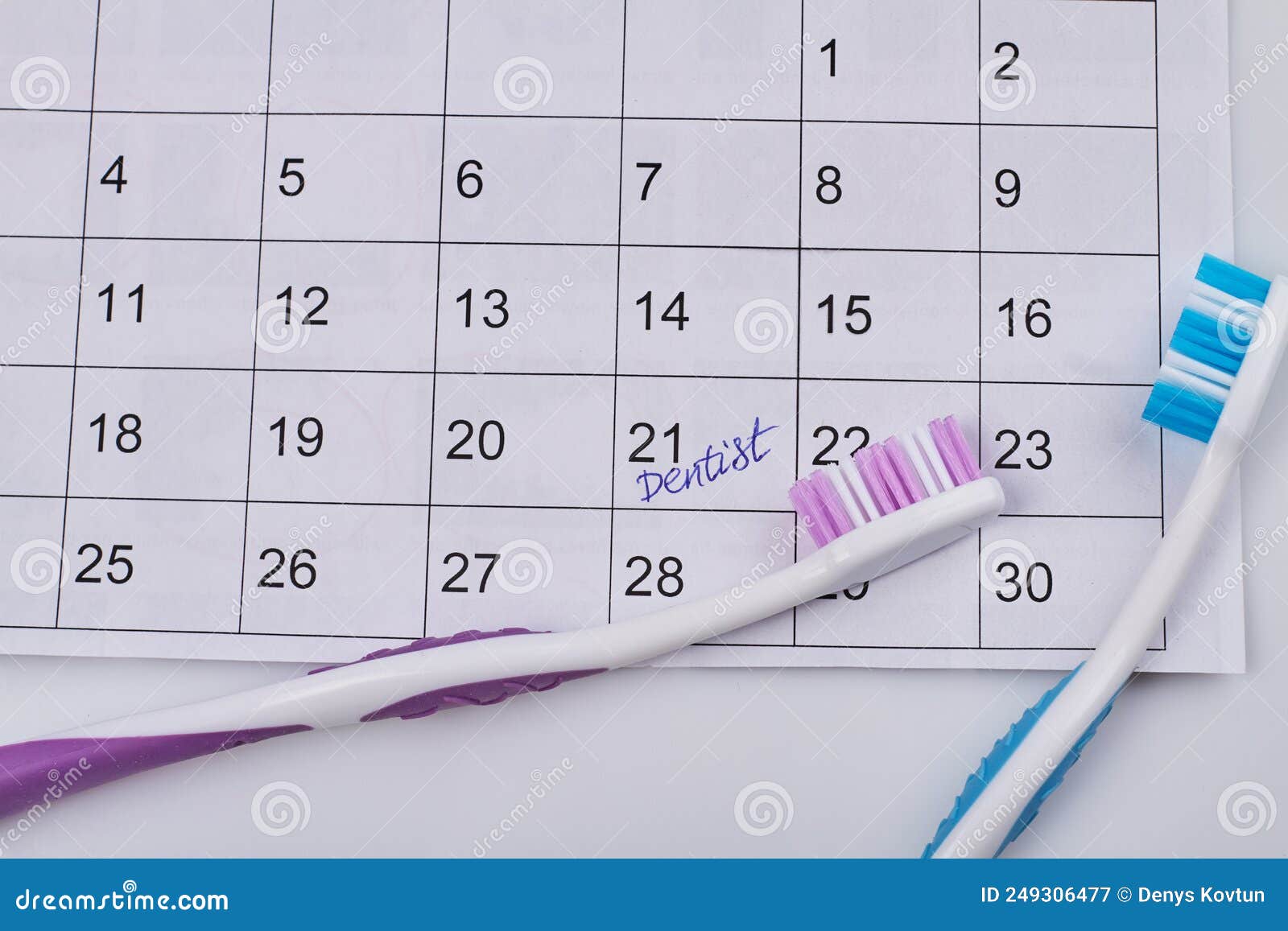 Dentist Day Concept. Marked 21 Day on the Calendar and Two Toothbrushes ...