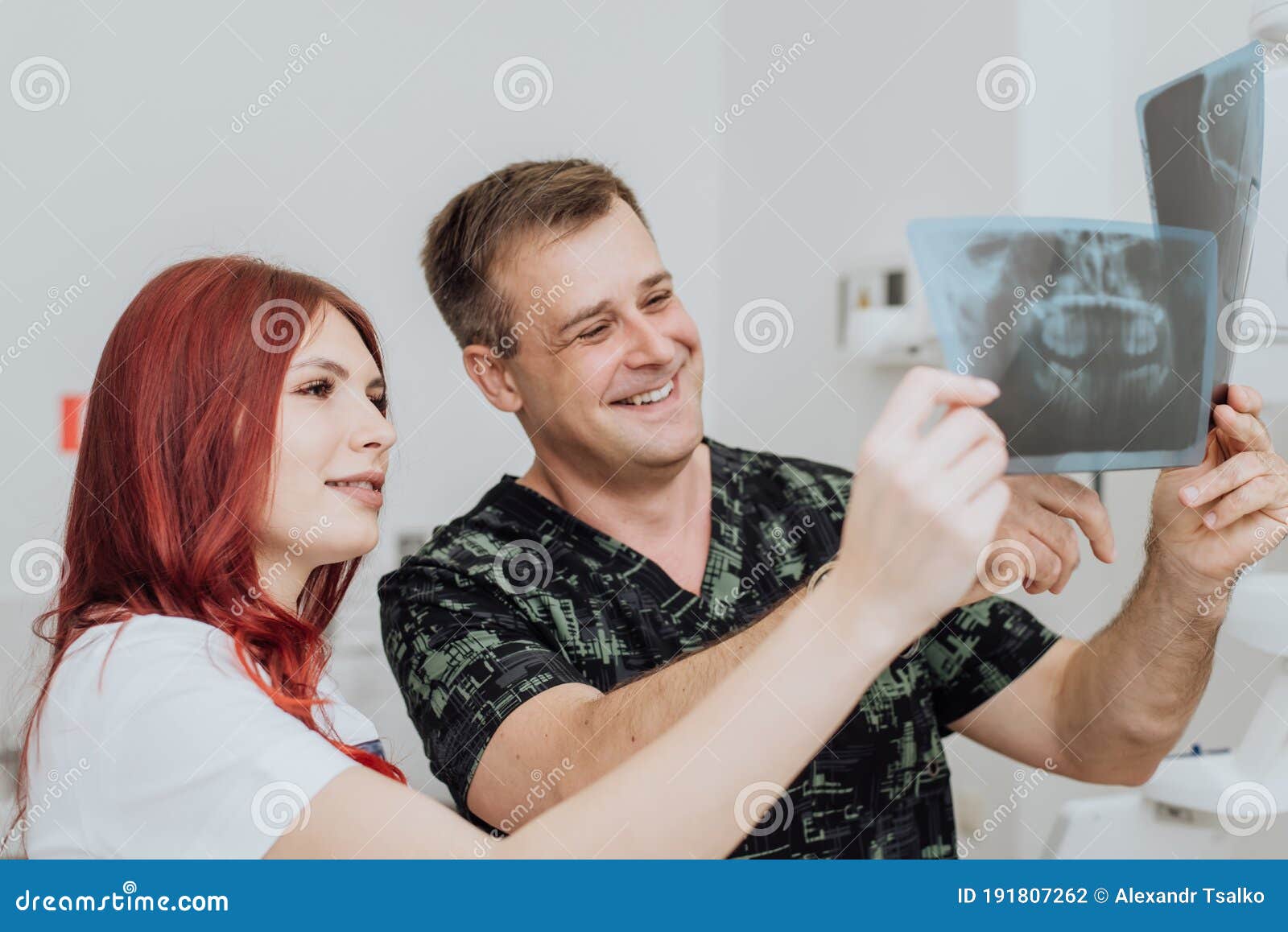Doctor Dentist with an Assistant Check the X-ray Orthopantomogram ...