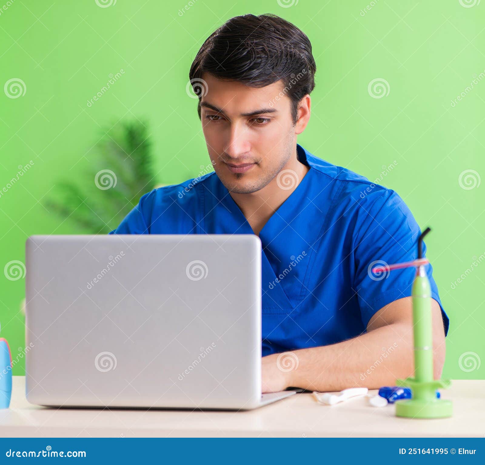 Dentist Doctor Sitting at Computer in the Clinic Stock Image - Image of ...