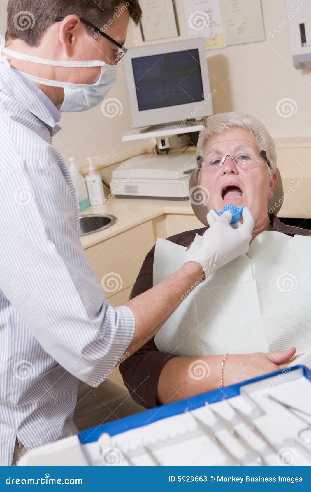 Dentist in Exam Room with Woman Stock Image - Image of care, looking ...