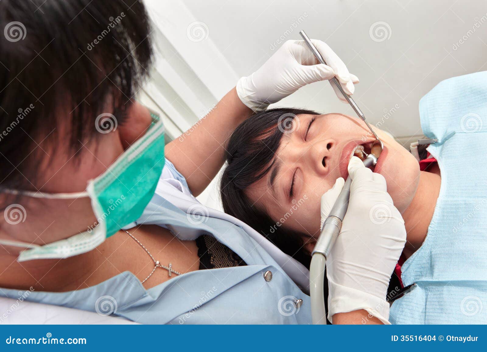 Dentist examing teeth stock photo. Image of professional - 35516404