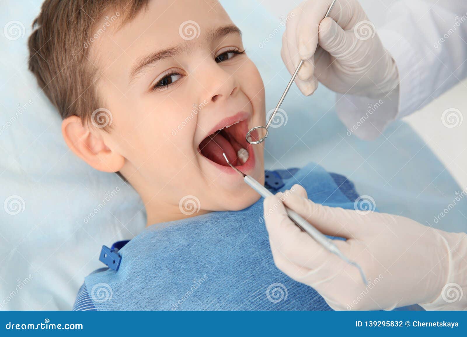 Dentist Examining Cute Boy`s Teeth Stock Photo - Image of closeup ...