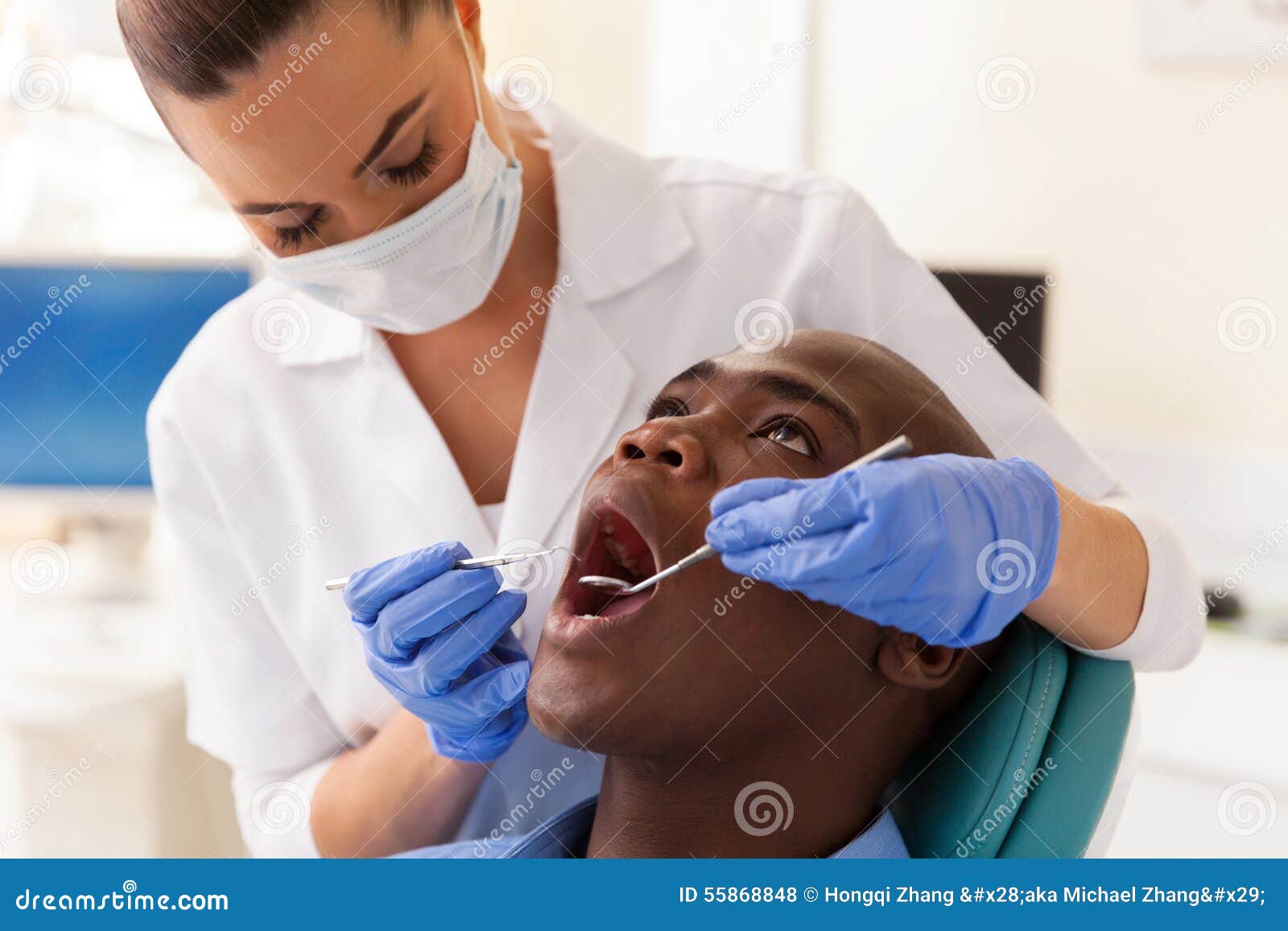 Dentist Examining Male Patient Stock Photo - Image of american ...