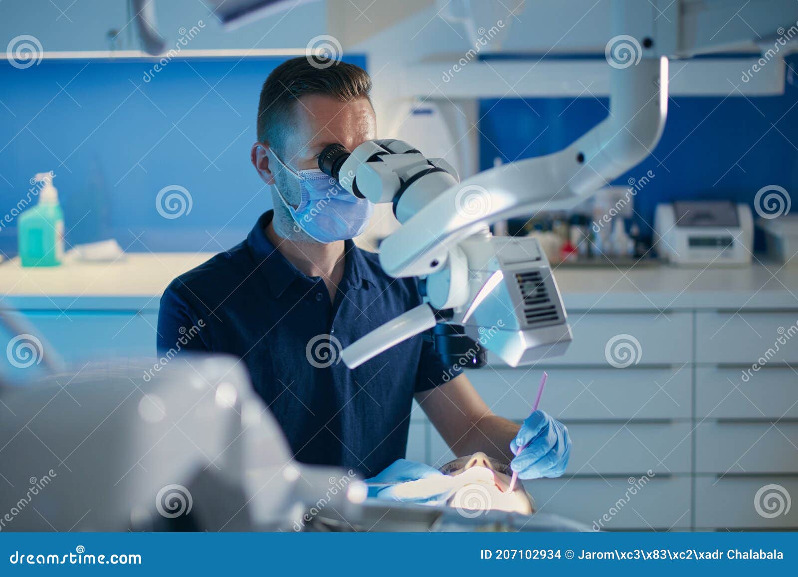Dentist Examining Patient in Modern Dental Surgery Stock Photo - Image ...