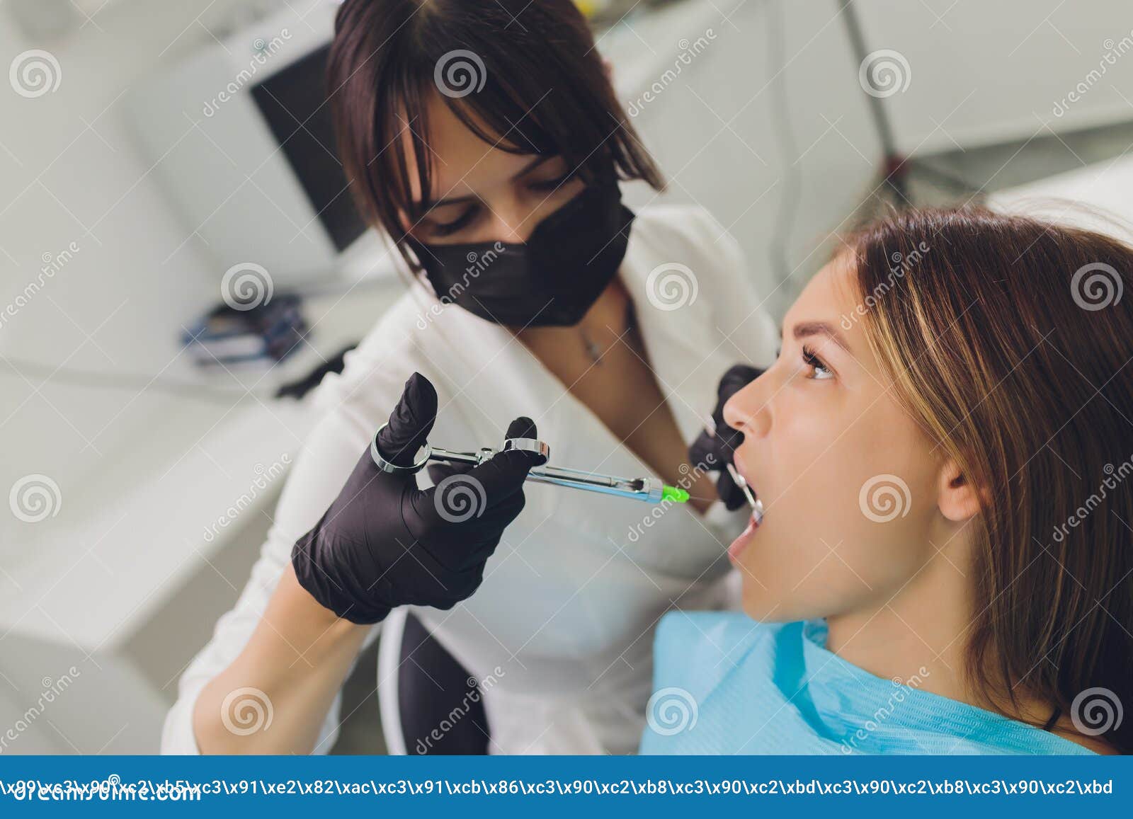Dentist Examining a Patient`s Teeth in the Dentist. Stock Photo - Image ...