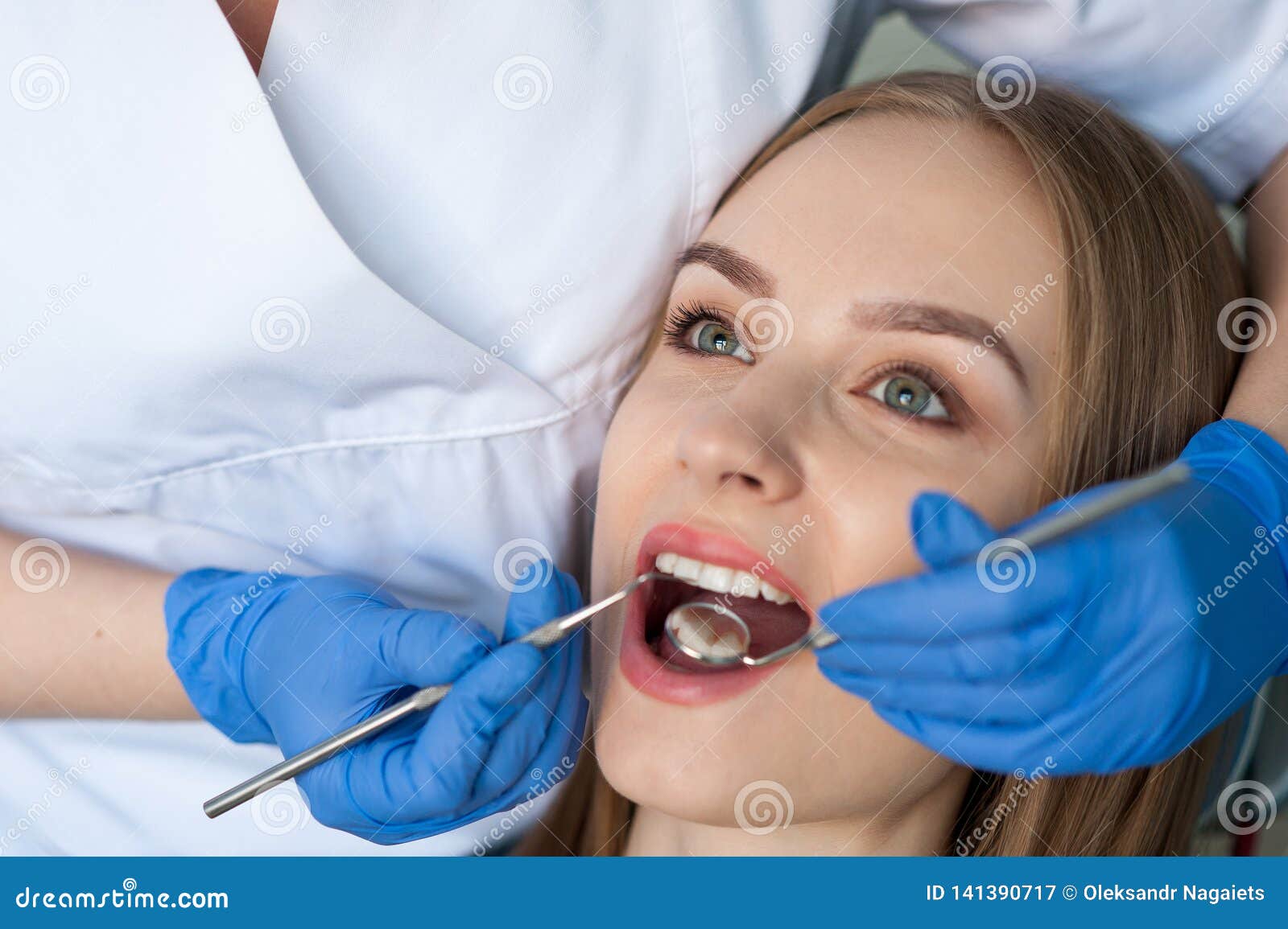 Dentist Examining a Patient`s Teeth in the Dental Clinic. Stock Image ... Dentist Examining a Patient`s Teeth in the Dental Clinic. Stock Image ...