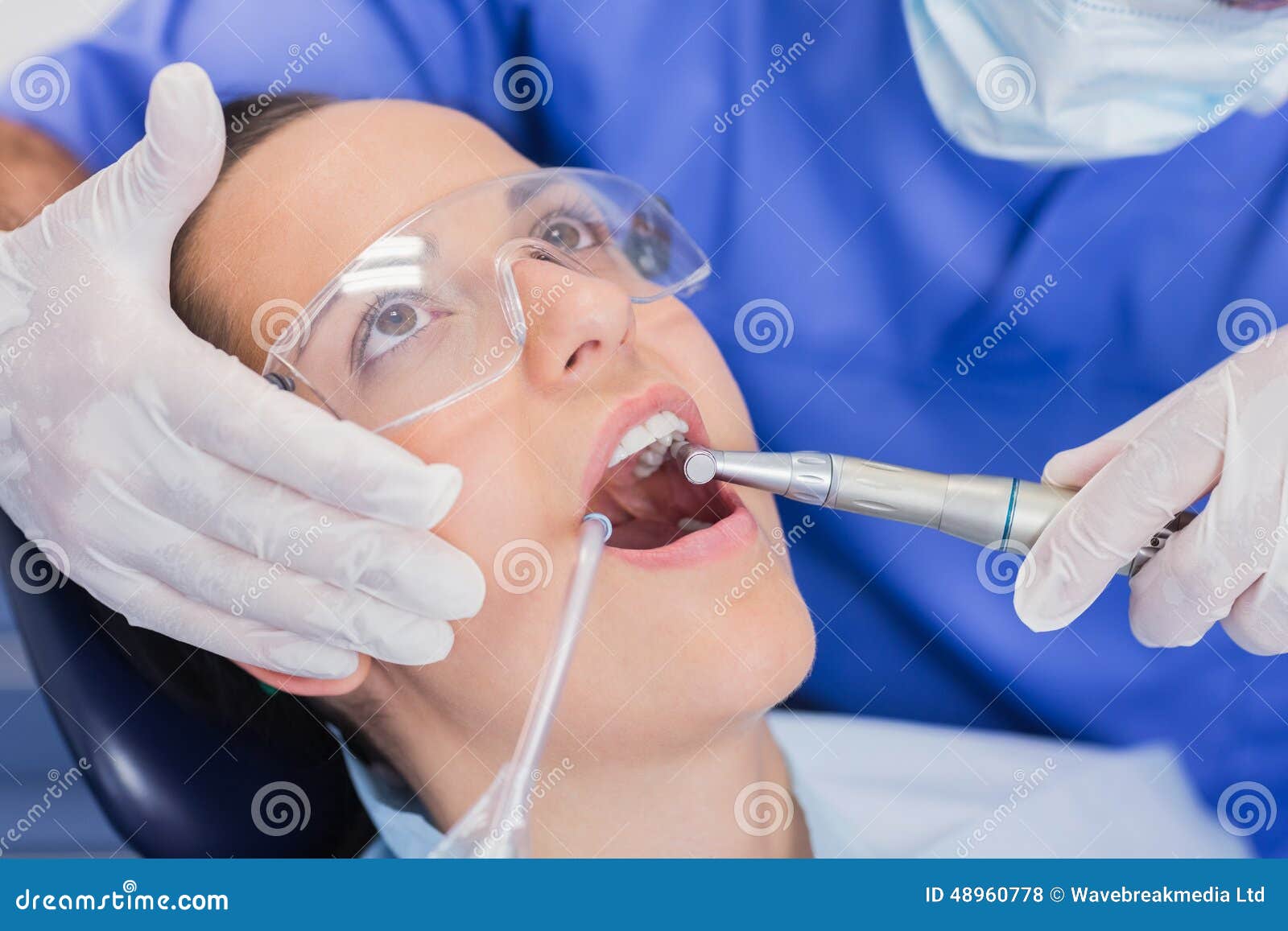 Dentist Examining a Patient with Tools Stock Photo - Image of dental ... Dentist Examining a Patient with Tools Stock Photo - Image of dental ...