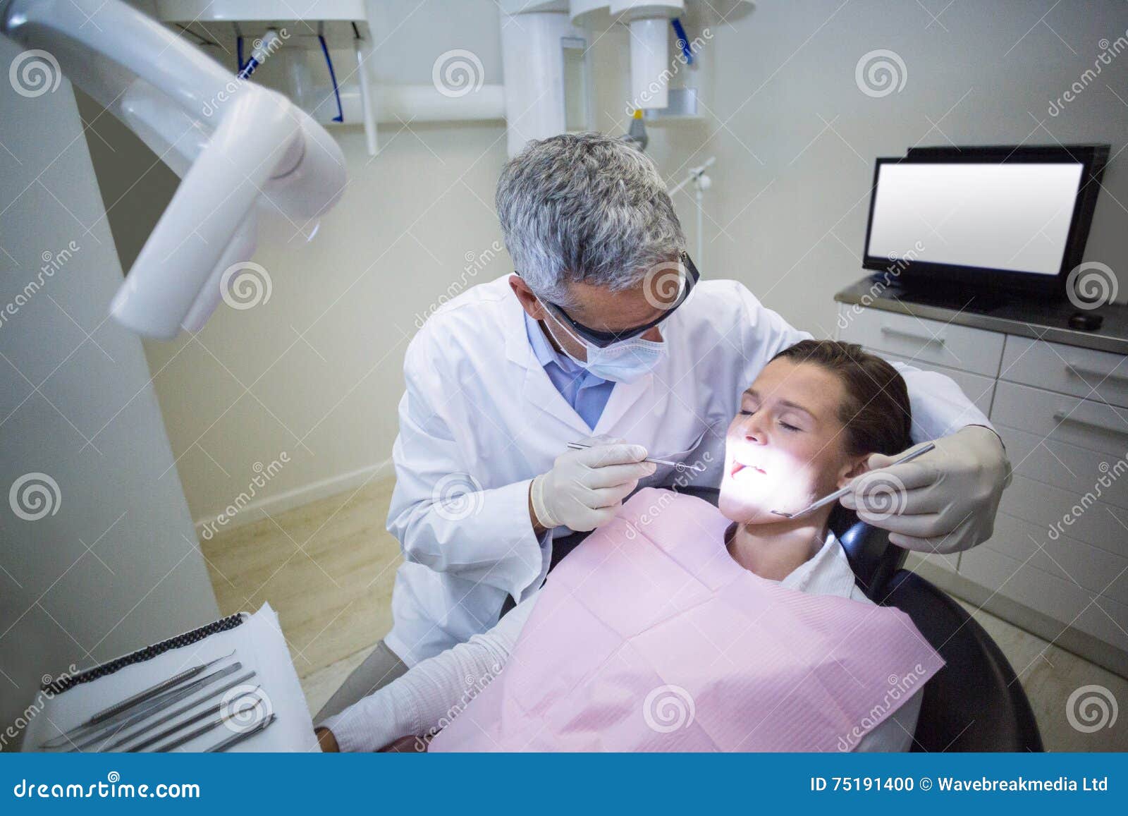 Dentist Examining a Patient with Tools Stock Photo - Image of ...
