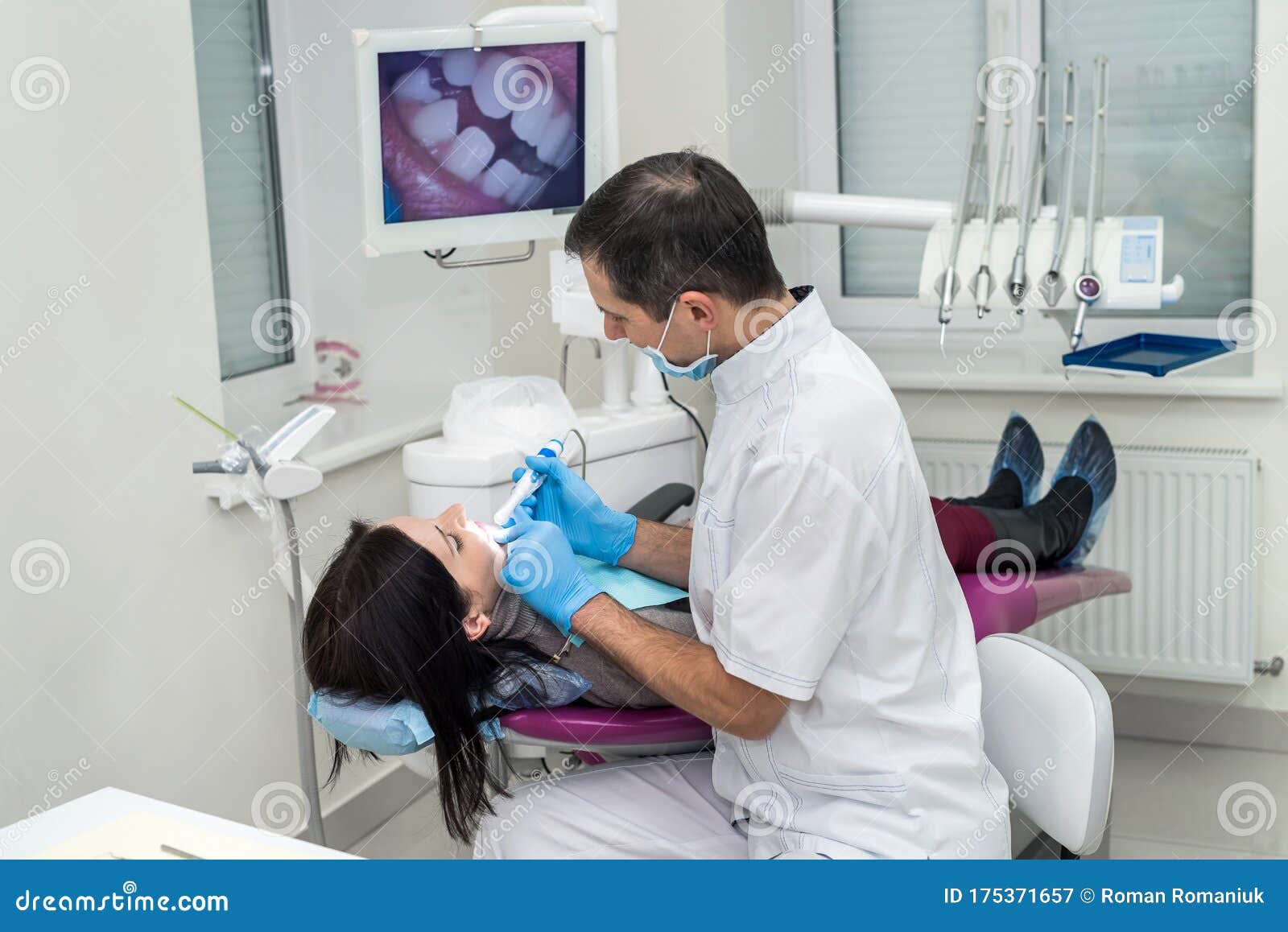 Dentist Examining Teeth with Camera, Looking on Screen Stock Image ...