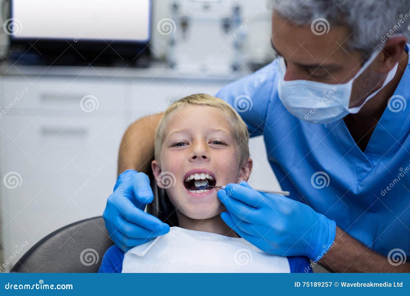 Dentist Examining a Young Patient with Tools Stock Image - Image of ...