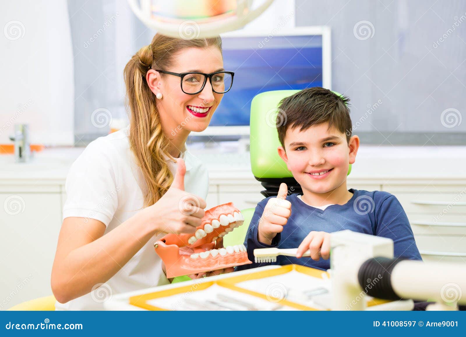 Dentist Explaining Boy Cleaning Tooth Stock Image - Image of female ...