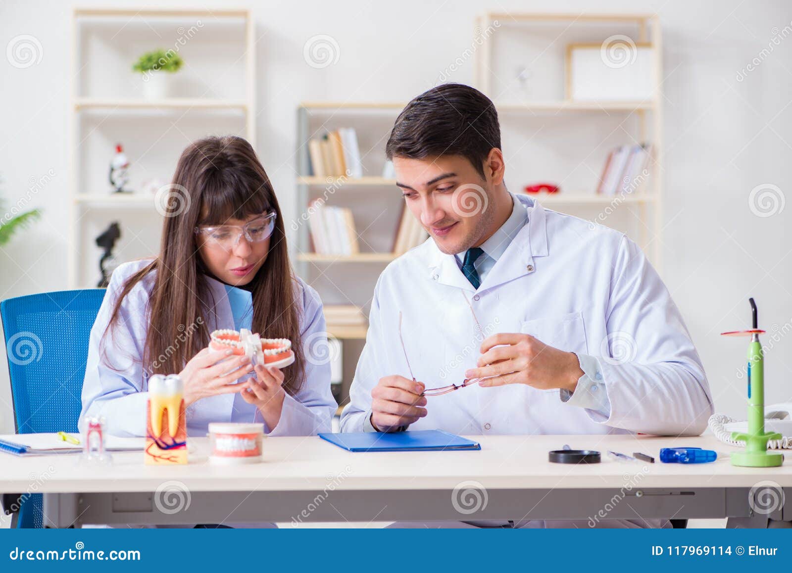 The Dentist Explaining Student Tooth Structure Stock Photo - Image of ...