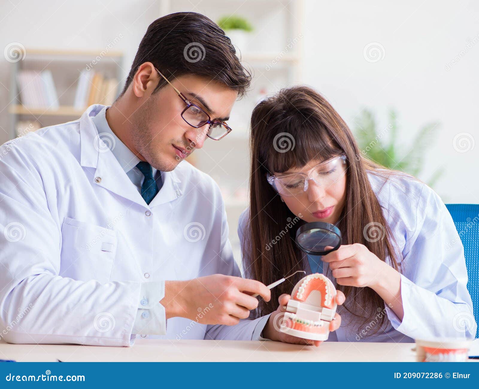 Dentist Explaining Student Tooth Structure Stock Photo - Image of ...