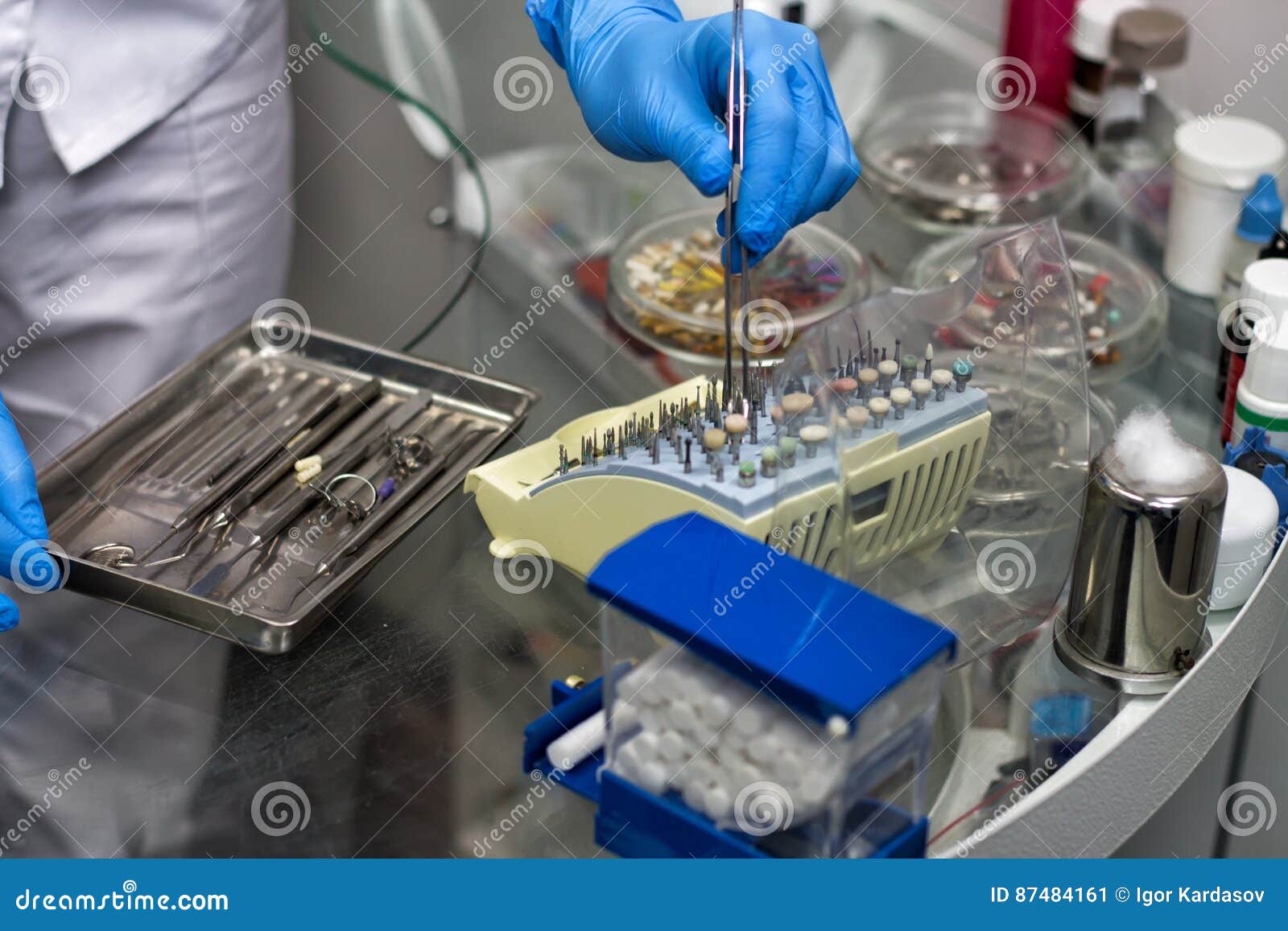 Dentist Holding Dental Instruments and Materials Stock Image - Image of ...