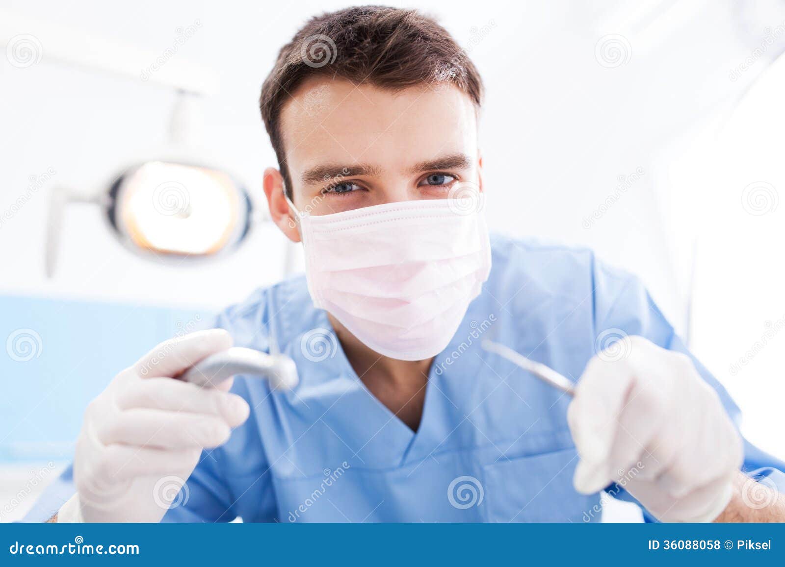 Dentist Holding Dental Tools Stock Photo - Image of holding, obscured ...