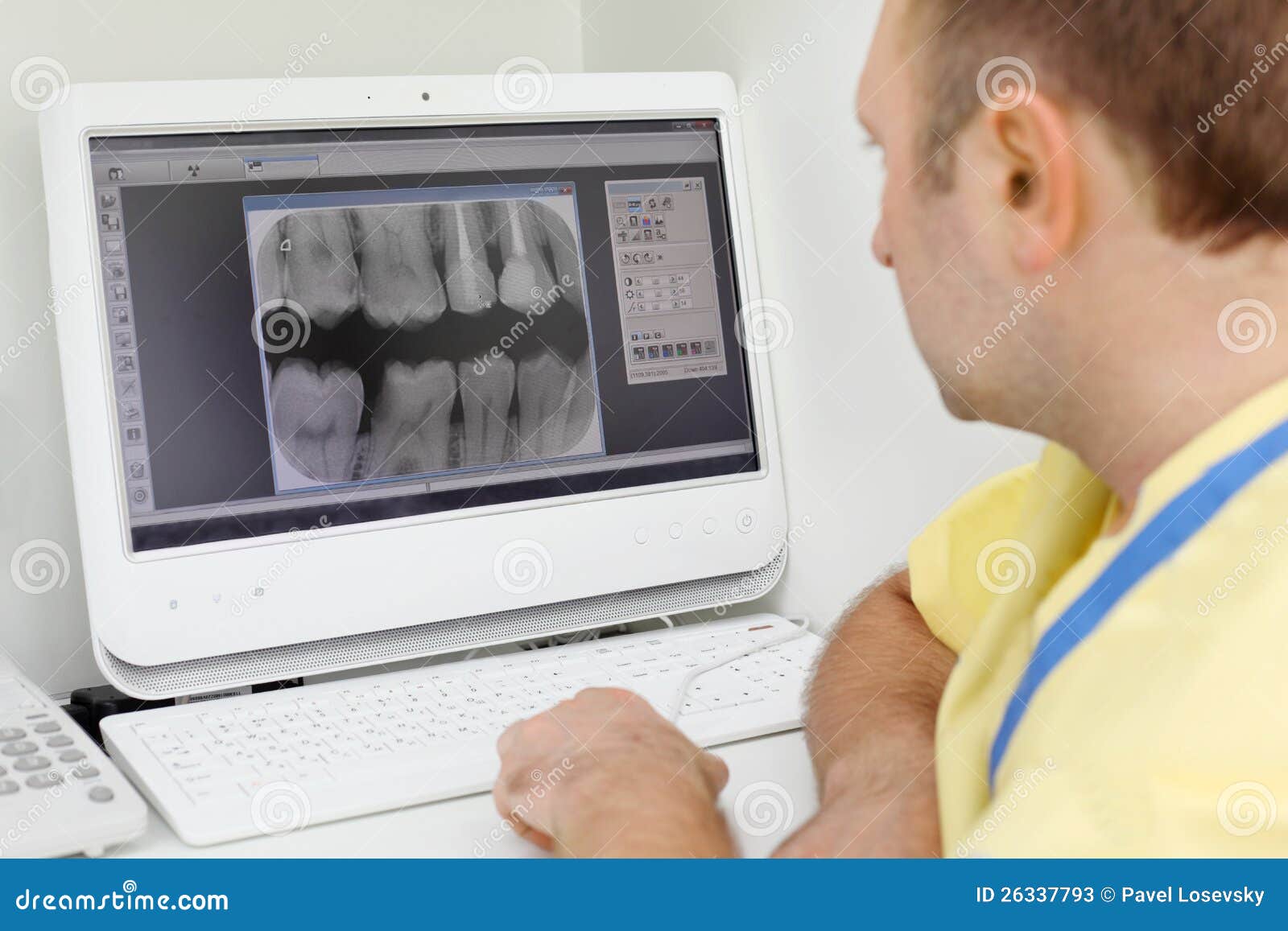 Dentist Looks At Teeth X-rays At Computer Monitor Stock Image ...