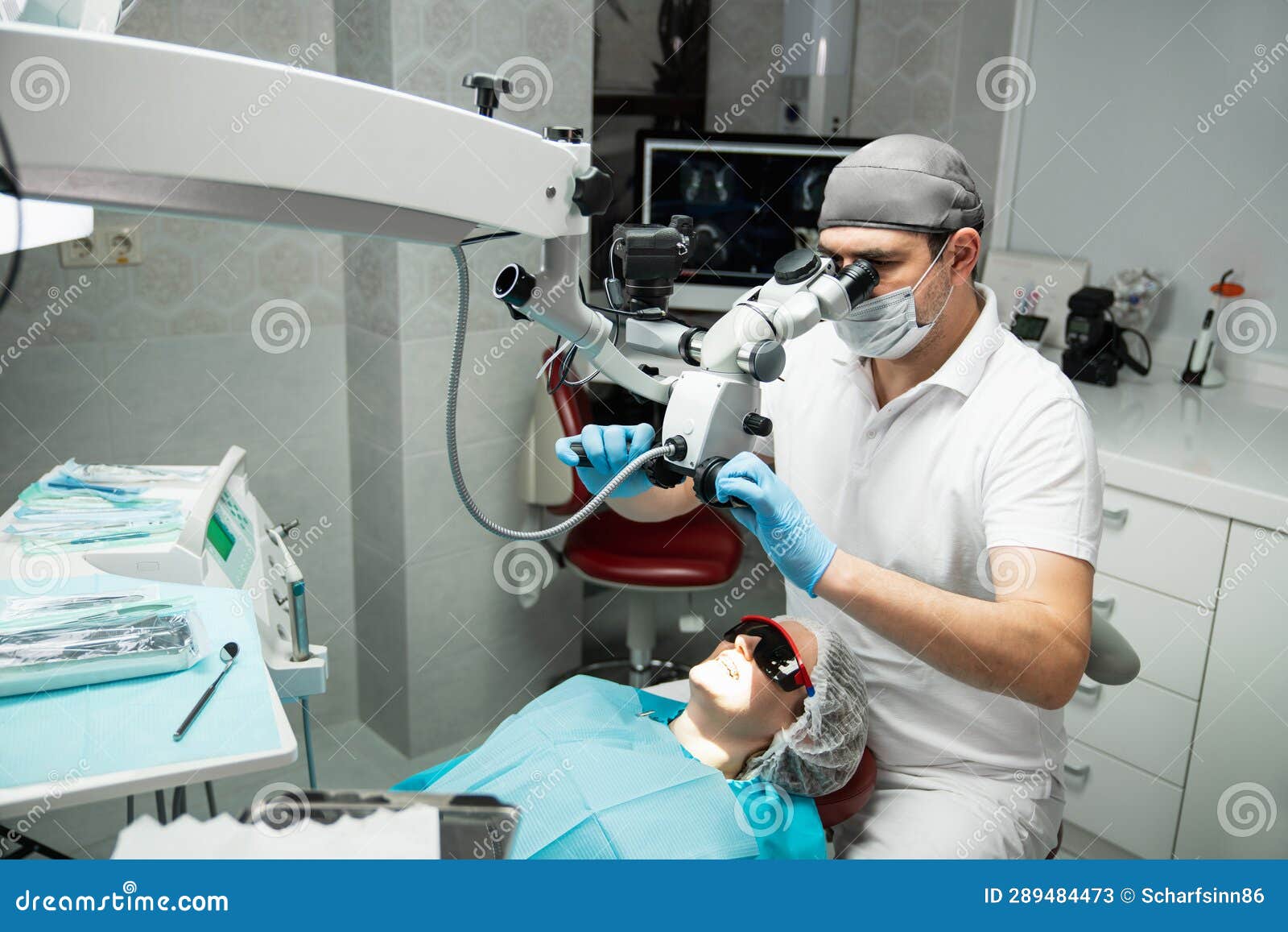 Dentist Makes an Operation Using a Dental Microscope Stock Image ...